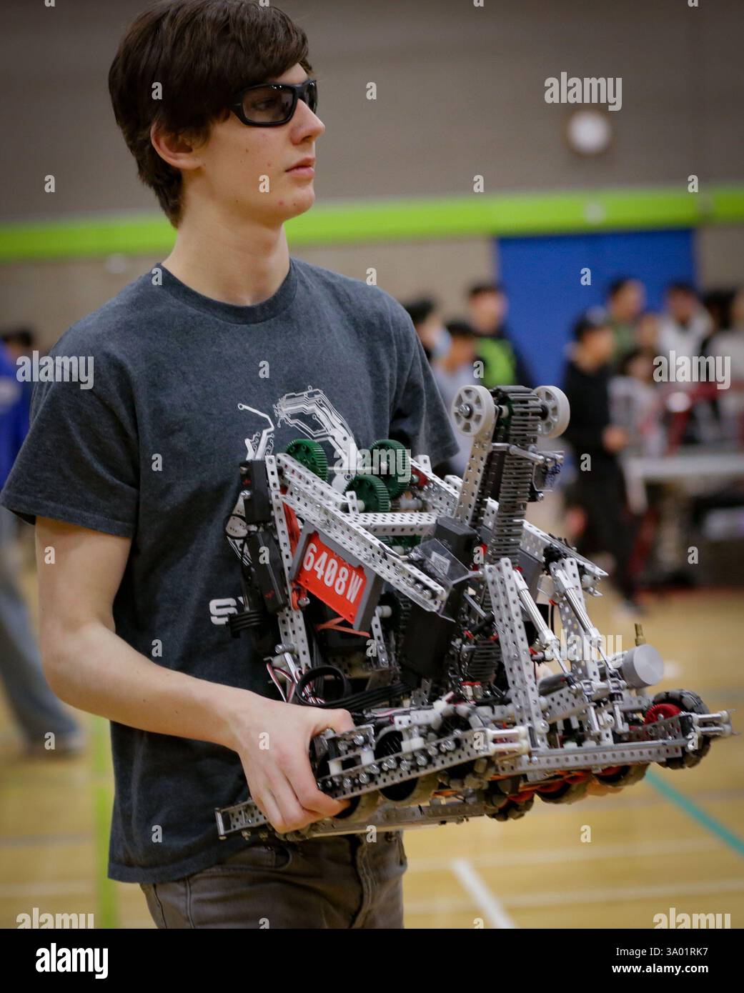 Burnaby, Canada. 1st Mar, 2025. A contestant carries his robot to the ...