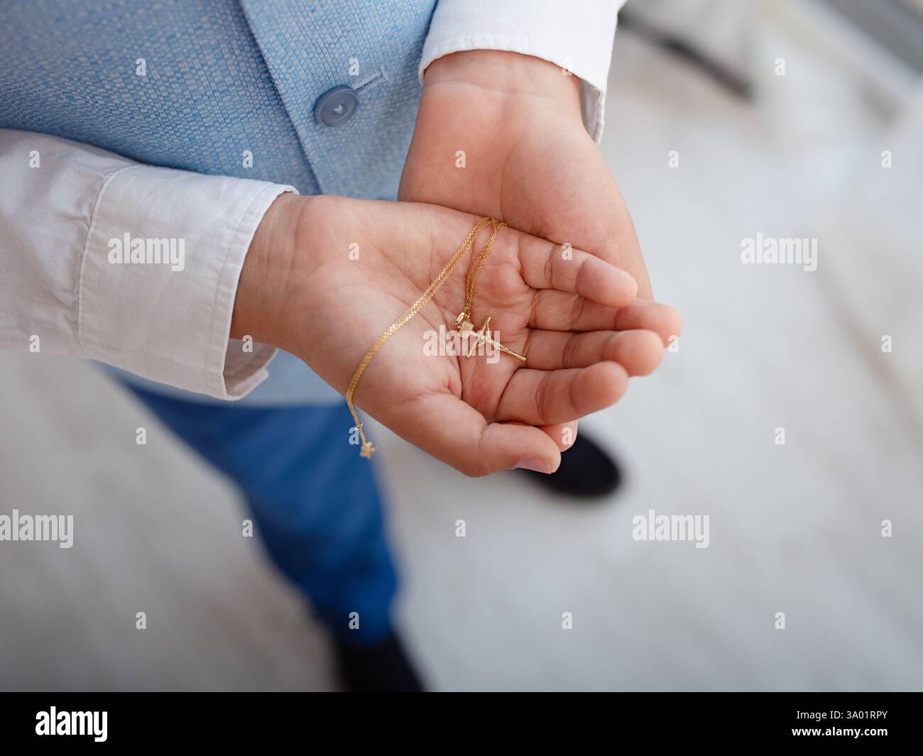 A Catholic cross is in children's hands Stock Photo - Alamy