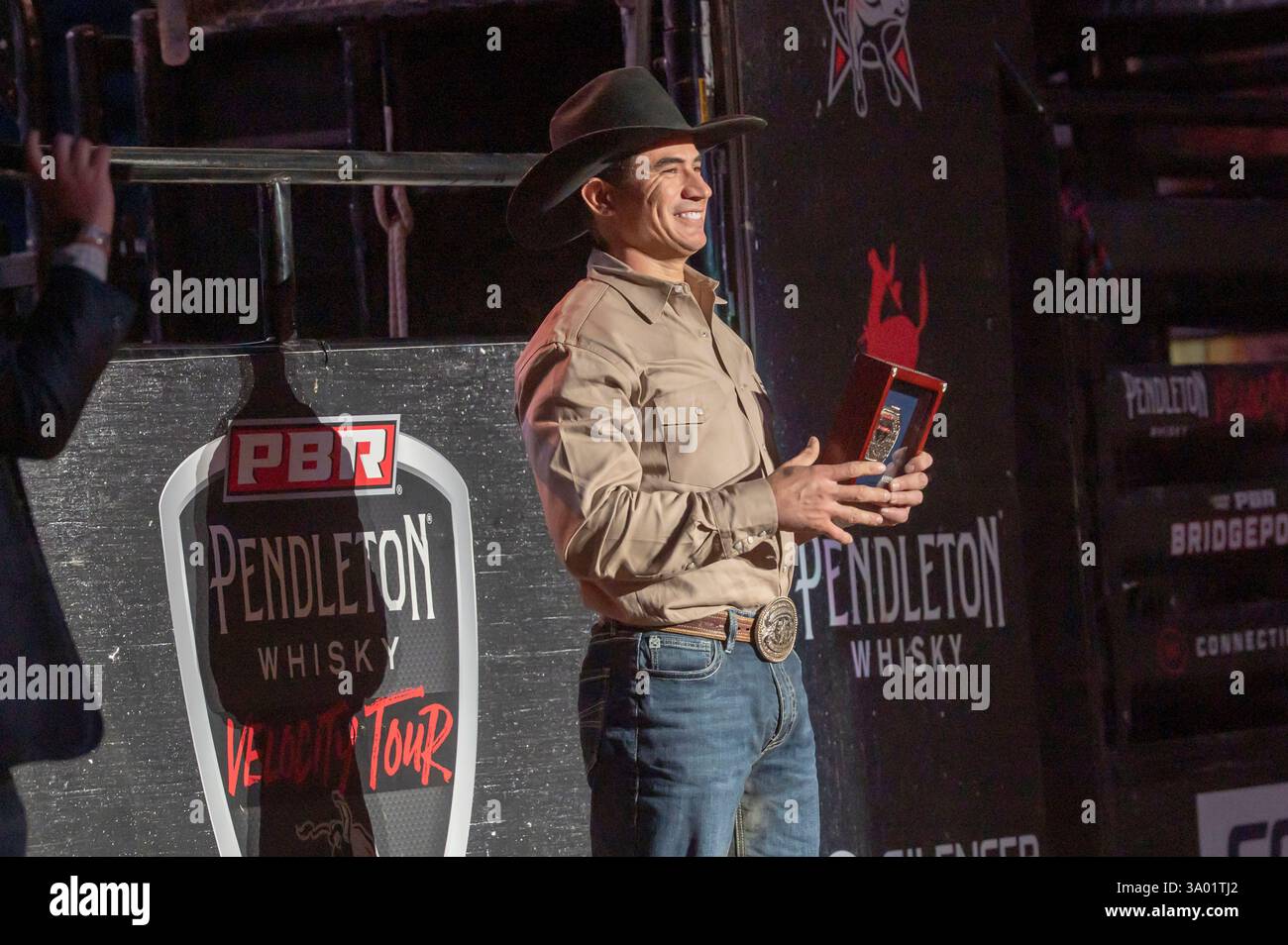 BRIDGEPORT, CONNECTICUT - MARCH 01: Ramon de Lima holding a custom belt ...