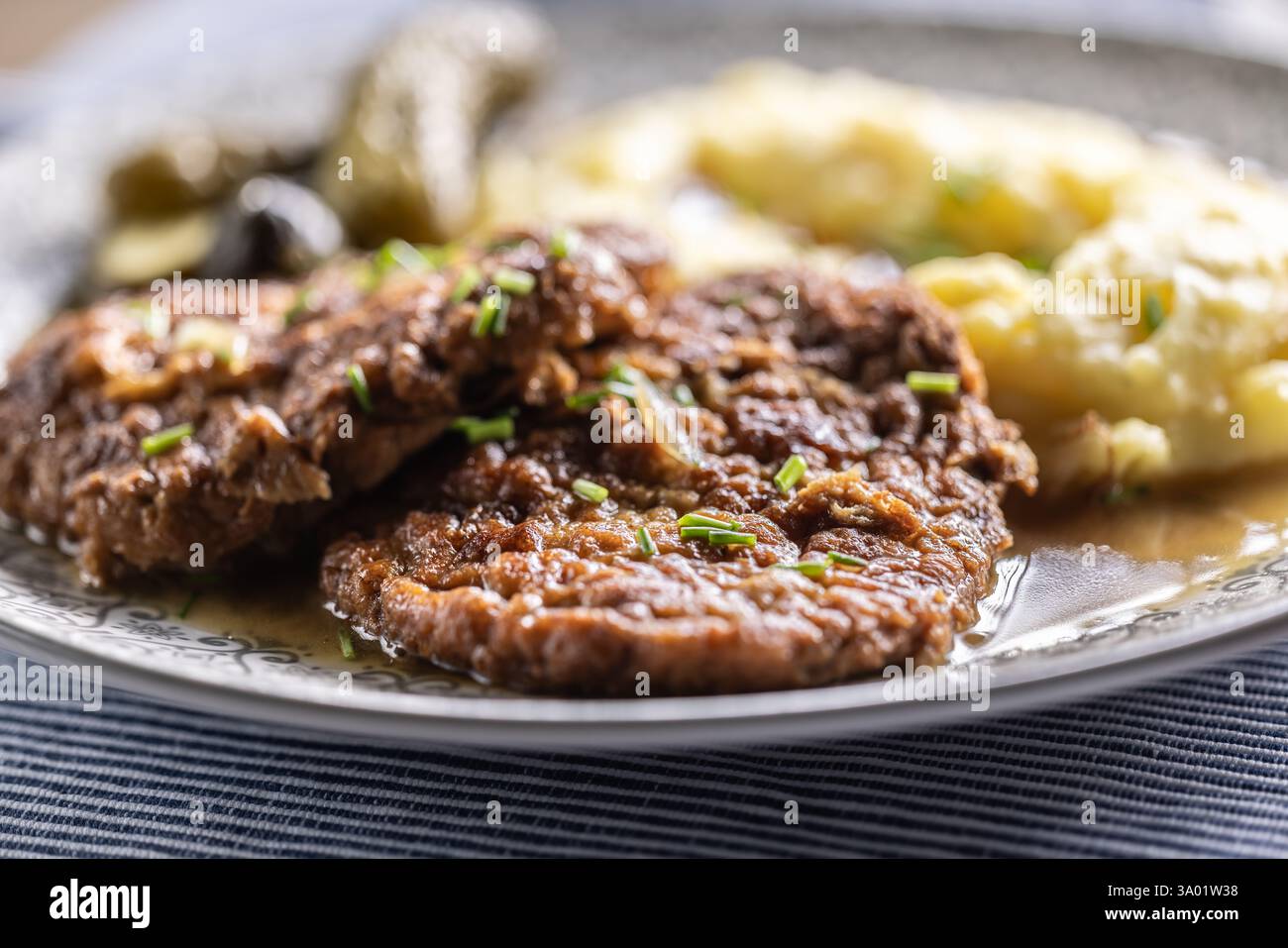 Inverted Beef Schnitzel with Mashed Potatoes and Pickled Cucumbers ...