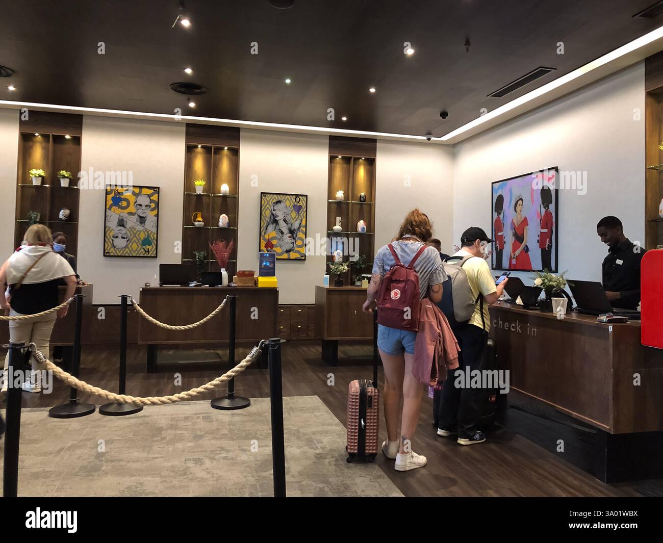 Guests interacting reception staff hotel hi-res stock photography and ...