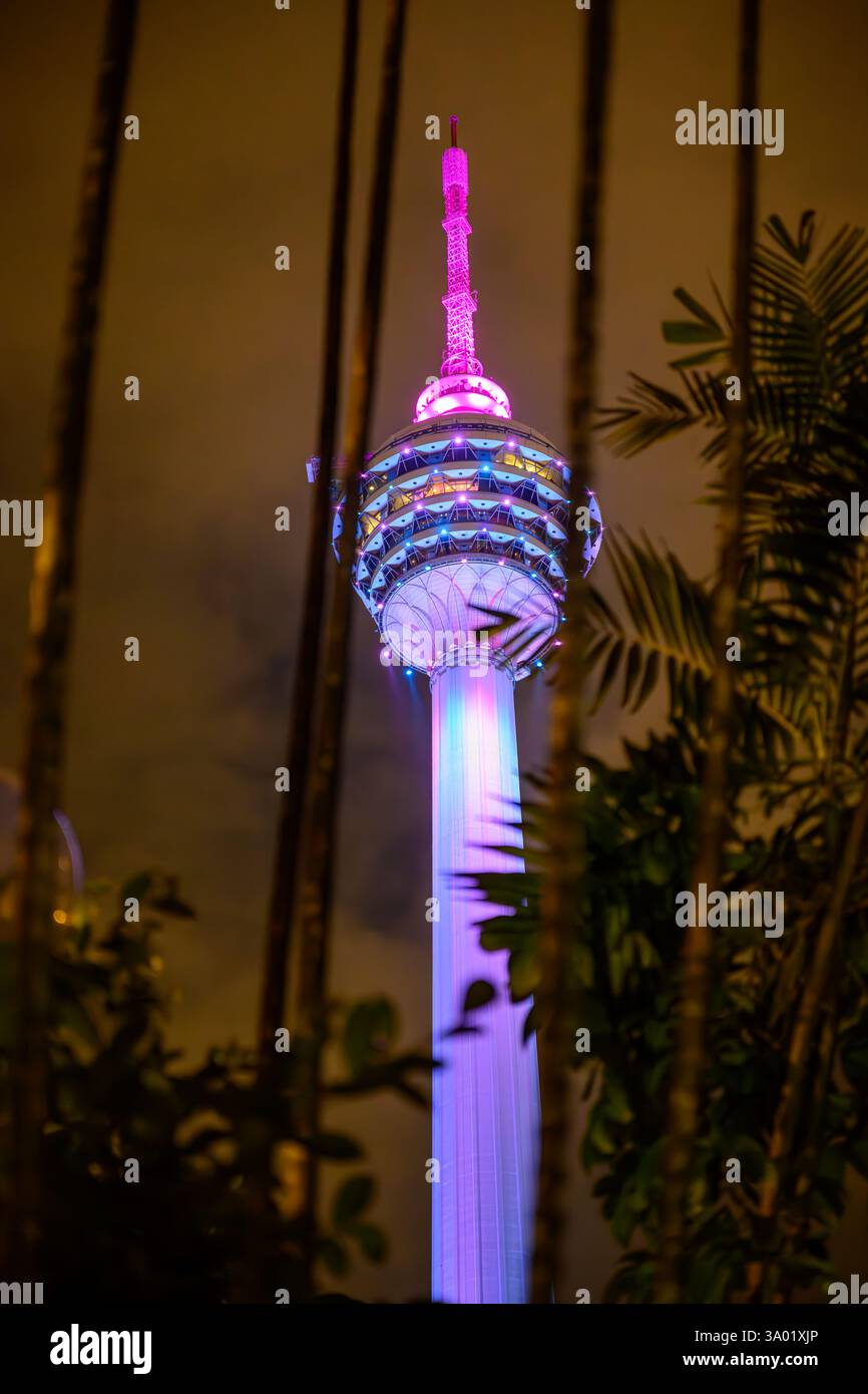 A close-up image of the illuminated KL Tower at night, Kuala Lumpur ...