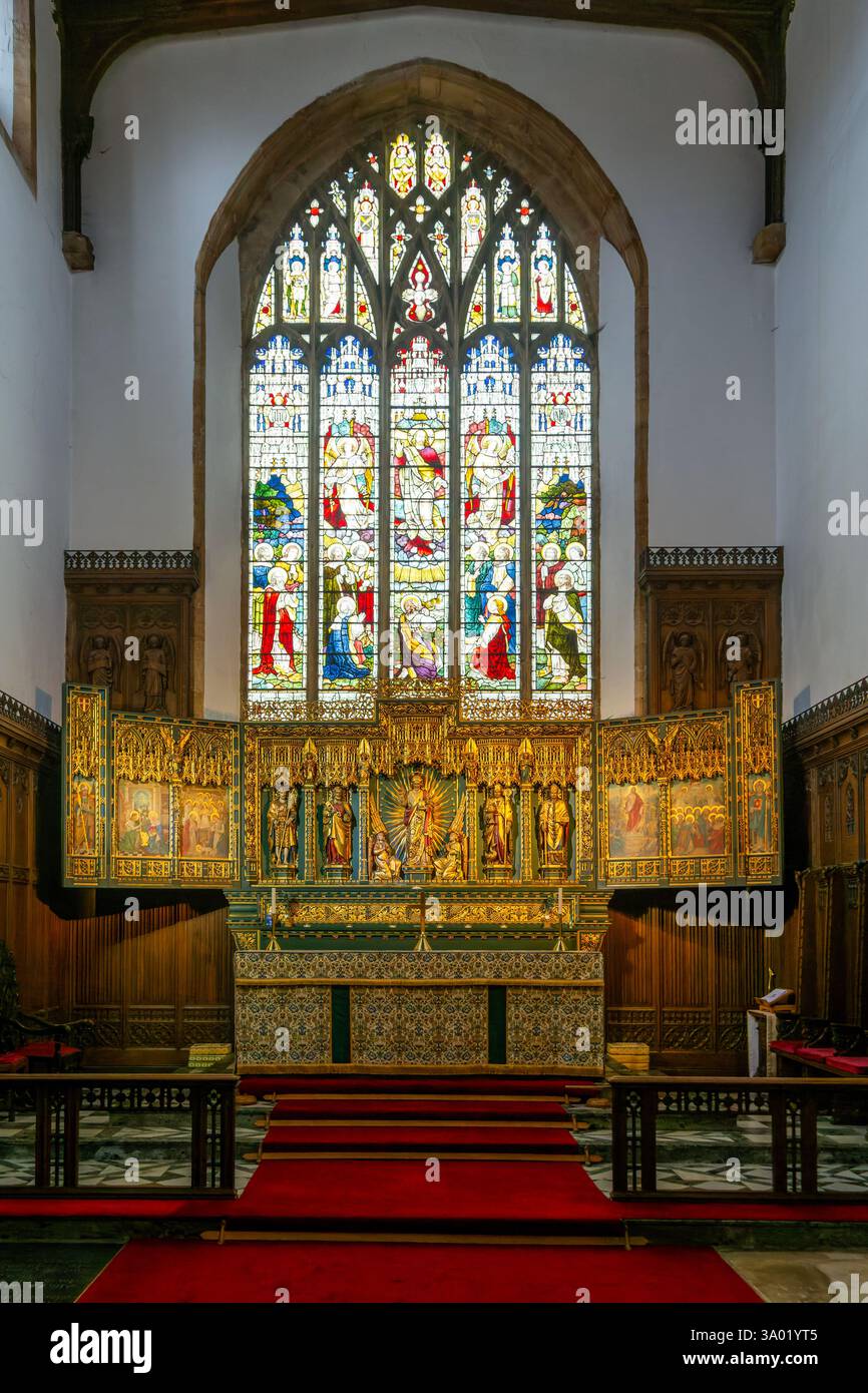 Stained glass east window, elaborately carved gilt altar reredos screen ...