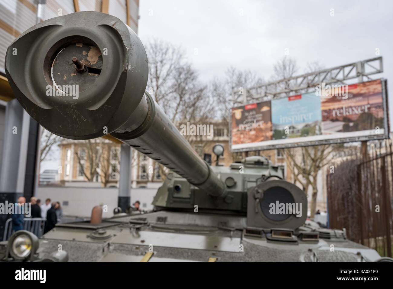 Military tank on display in urban environment captures attention of ...