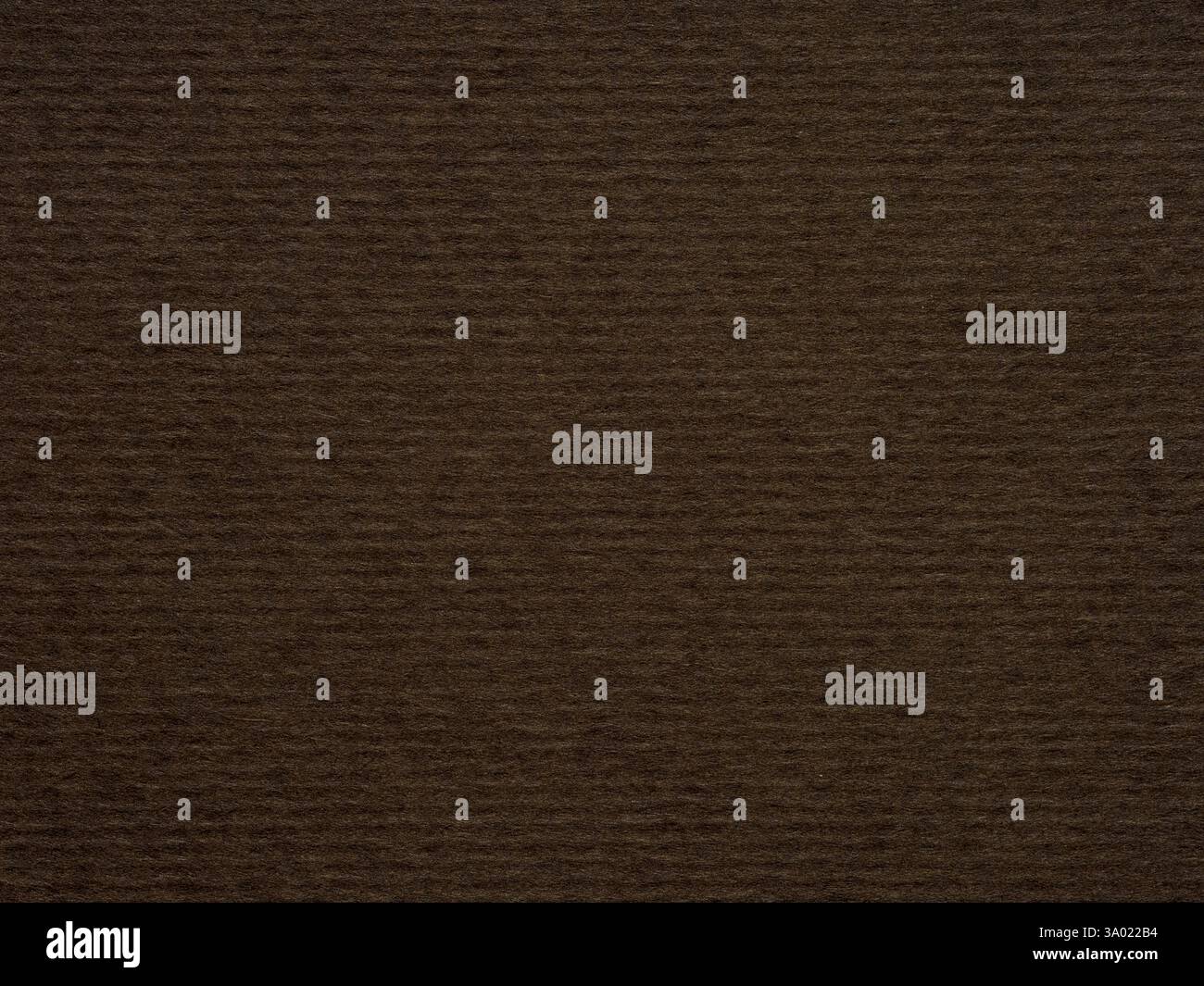 A rich brown canvas, the paper's texture tells a story of earthy roots ...