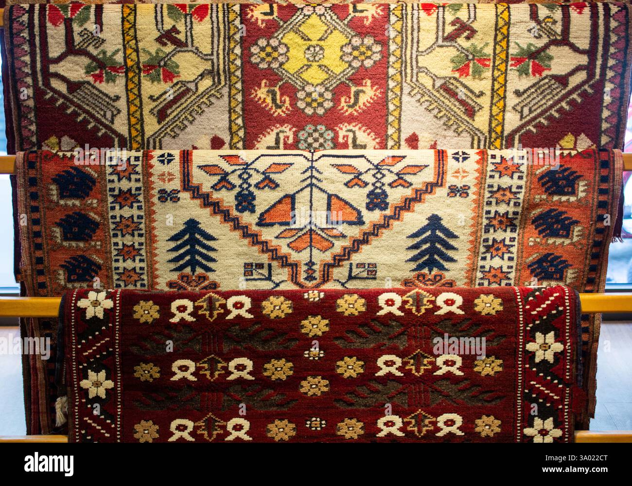 Traditional Turkish rug textile with patterns in bazaar Stock Photo - Alamy