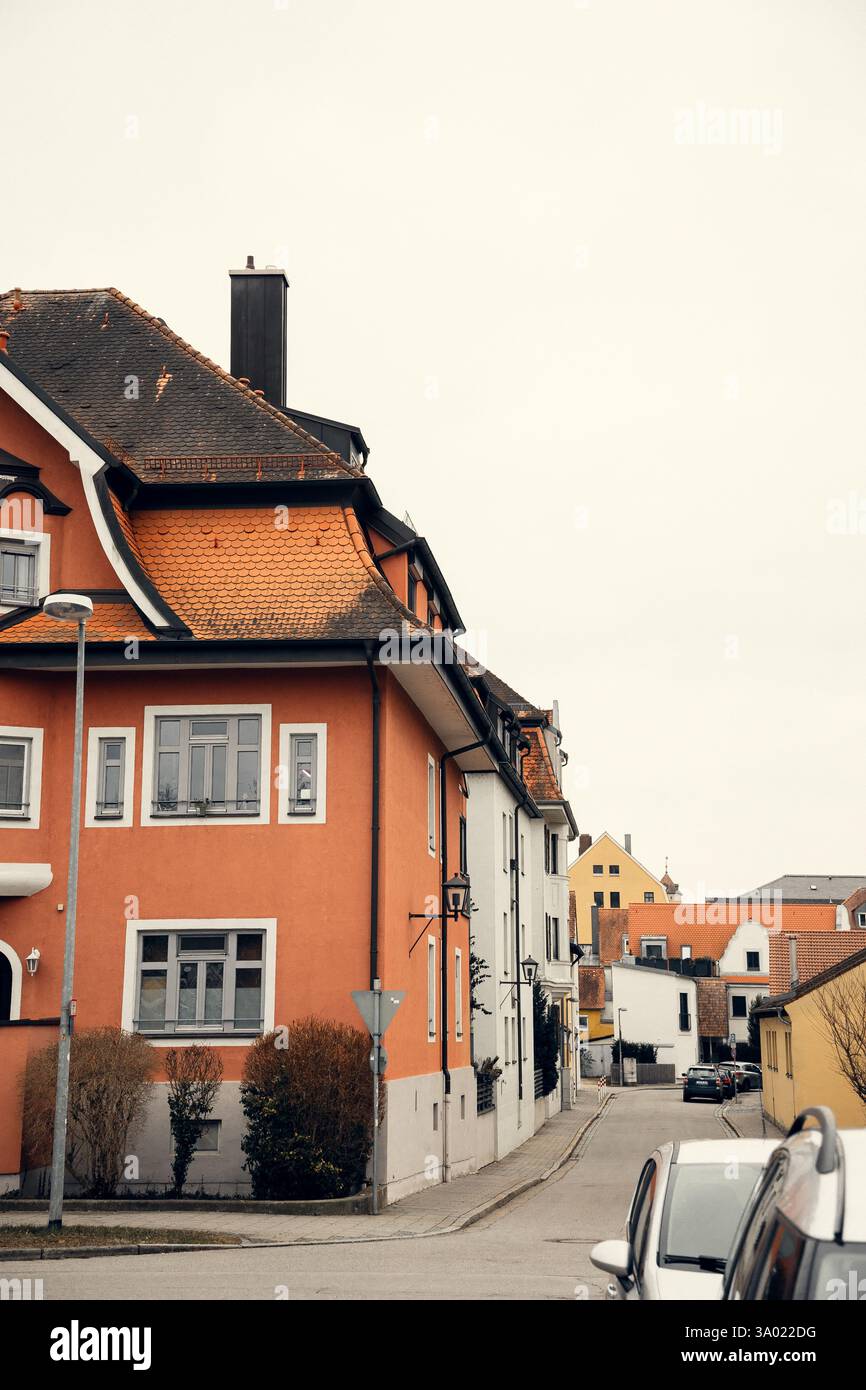 A European street lined with historic buildings featuring red-tiled ...