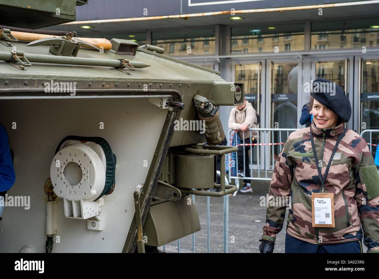 Military exhibition showcasing armored vehicles with enthusiastic ...