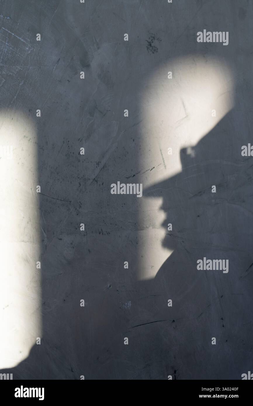 Distorted Silhouette of Mans Face Against Wall Stock Photo - Alamy
