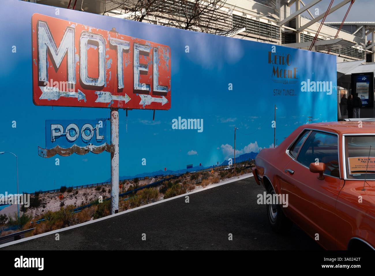 Vintage motel sign and classic car create nostalgic atmosphere at a ...