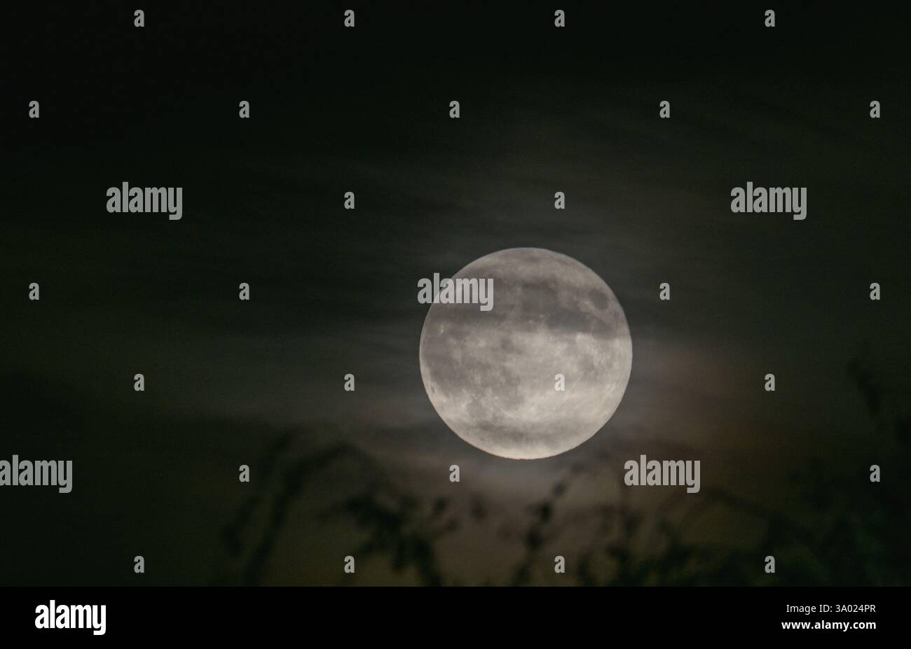 Full Moon Shining Through Mysterious Night Clouds Stock Photo - Alamy