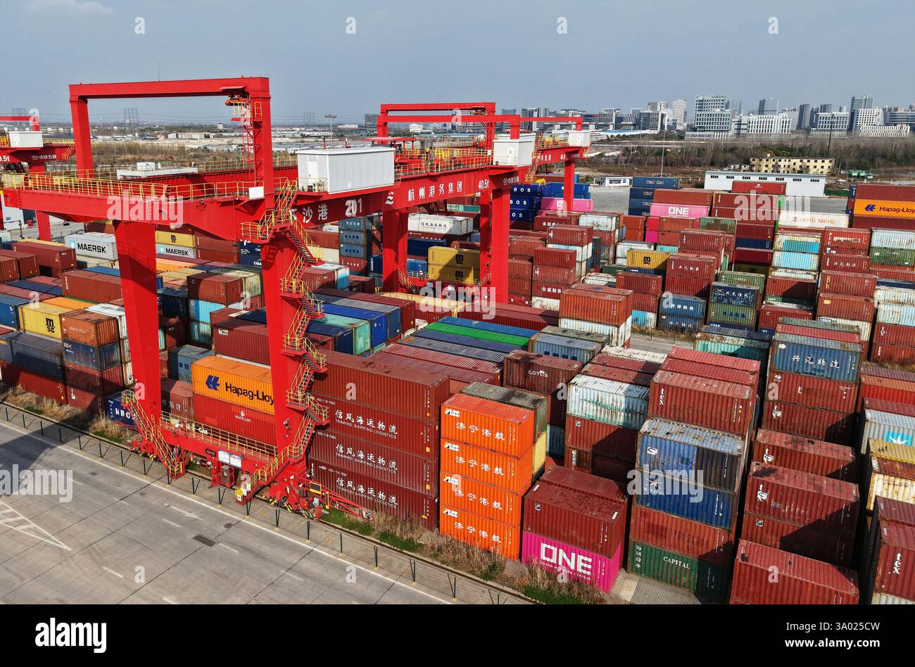 HANGZHOU, CHINA - MARCH 2, 2025 - Foreign trade containers are stacked ...