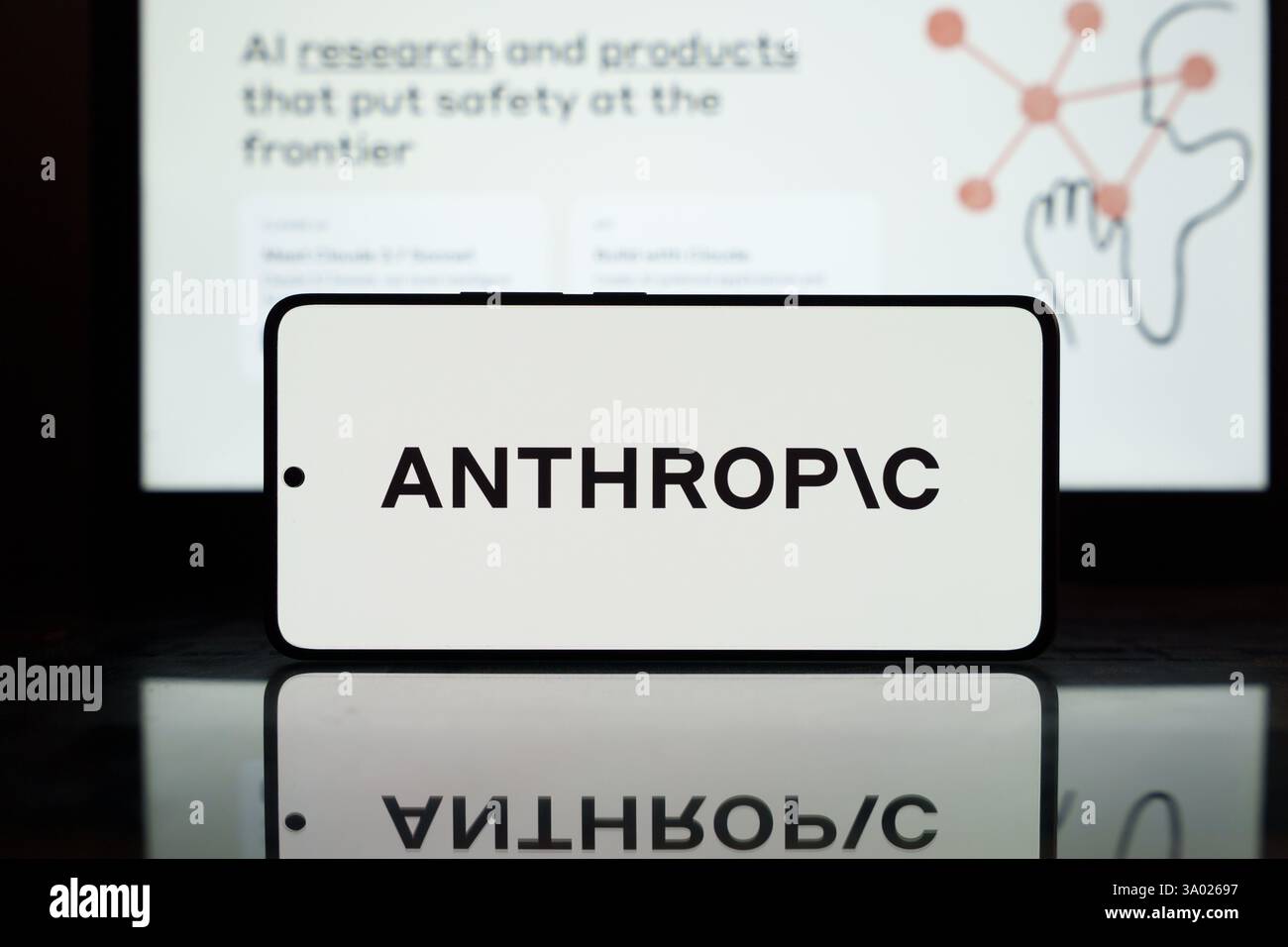 Anthropic AI logo displayed on a smartphone screen with a blurred ...