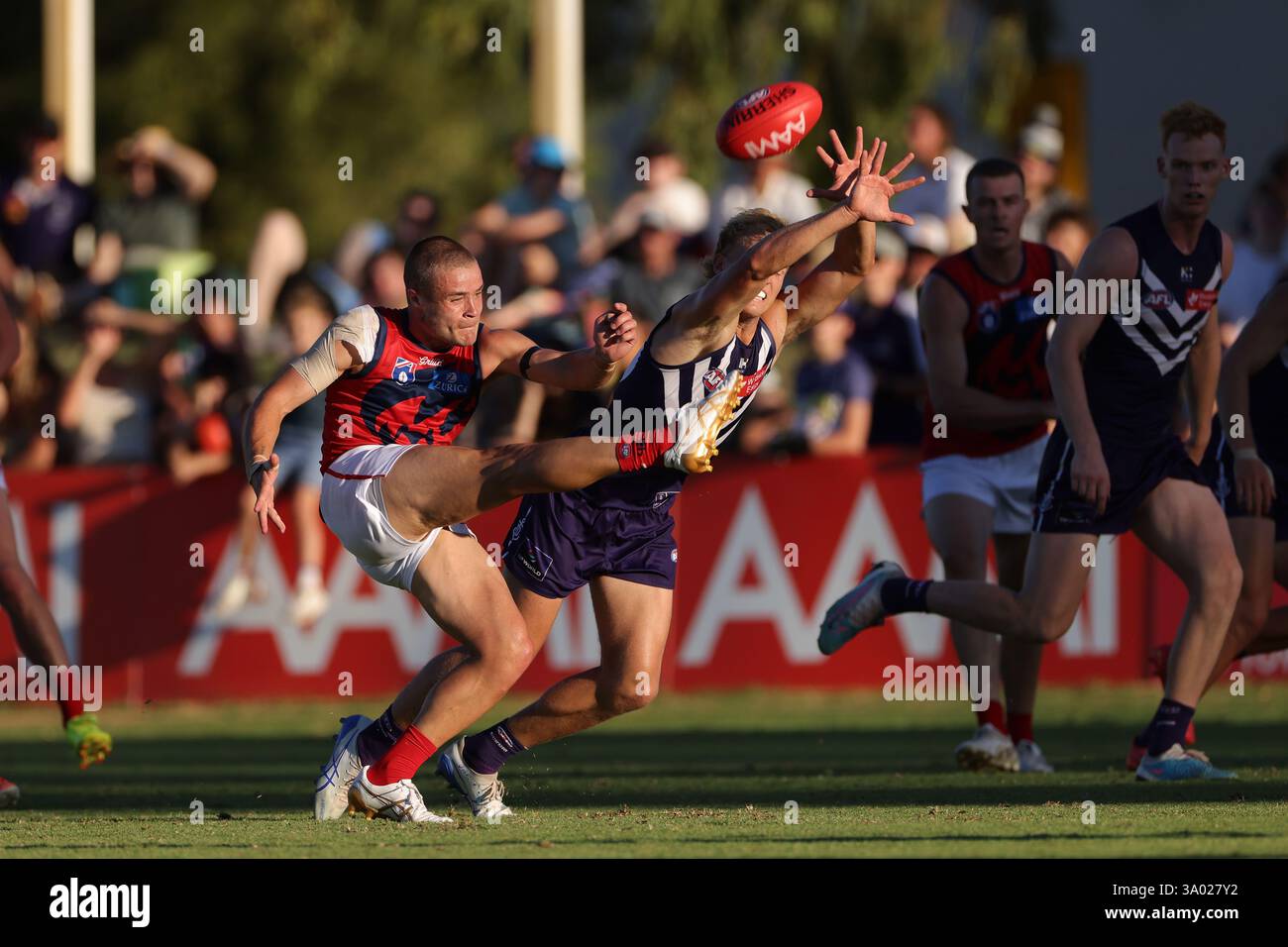 Kade Chandler of the Demons kicks on goal during the AFL Community ...