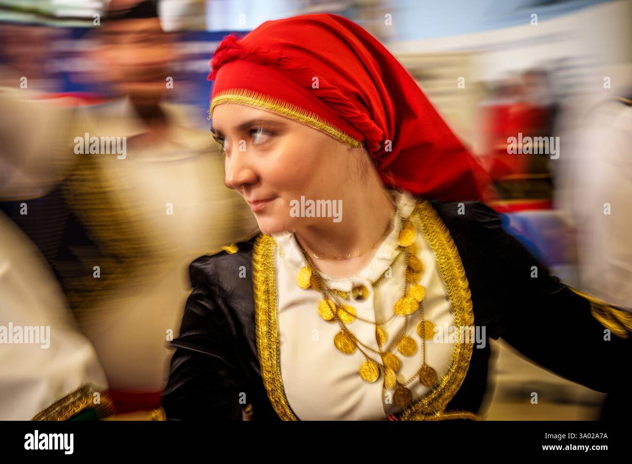 A girl of a Romanian ethnic Greek group dances during a show at the ...
