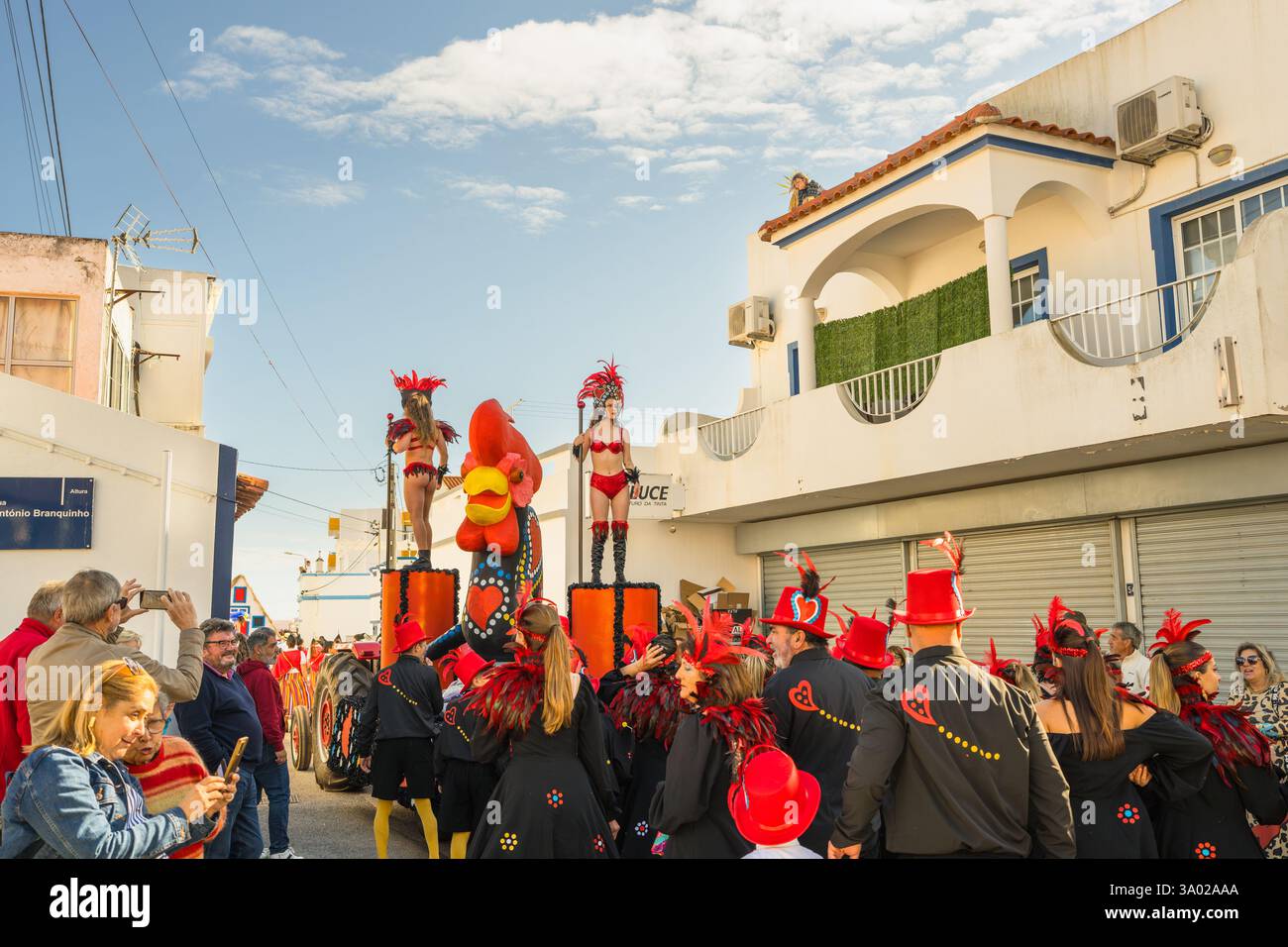 Altura, Portugal, March 1, 2025. Two carnival performers in red ...