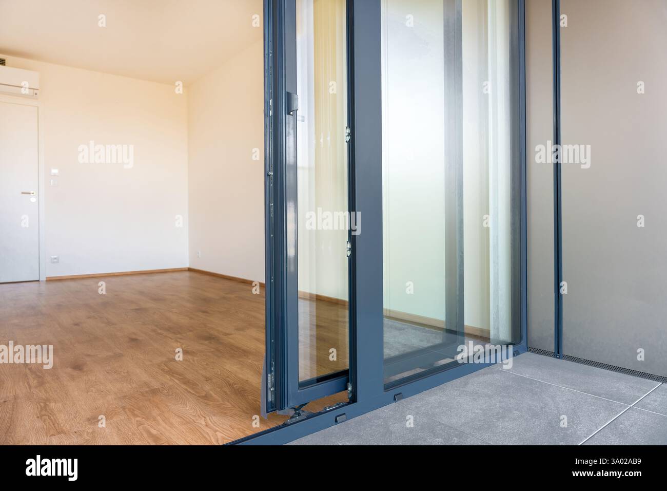 Tilt and slide glass door system for modern balcony access in ...