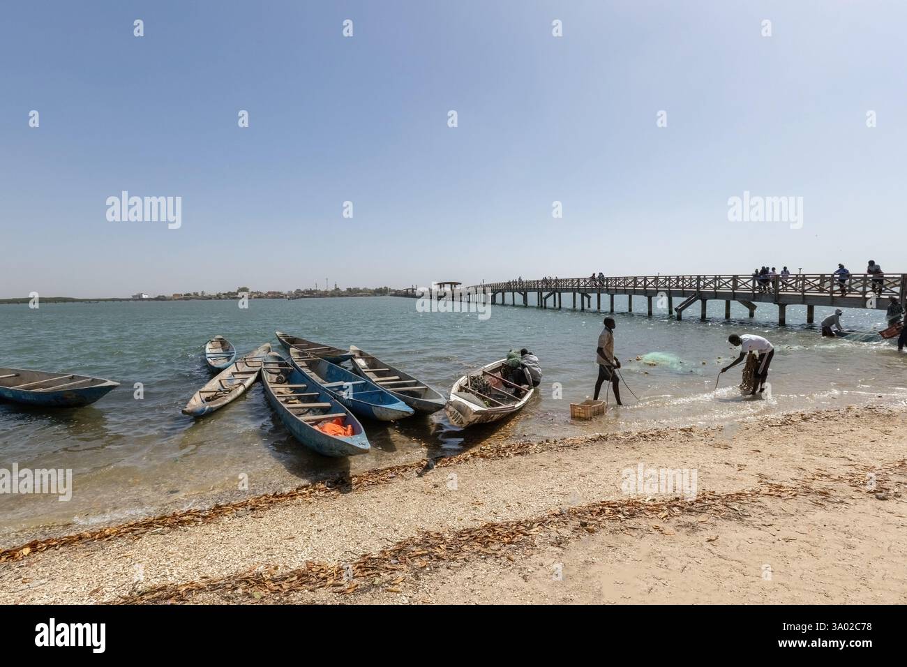 Fishing boats on the beach at Joal Fadiouth the shell island Senegal ...