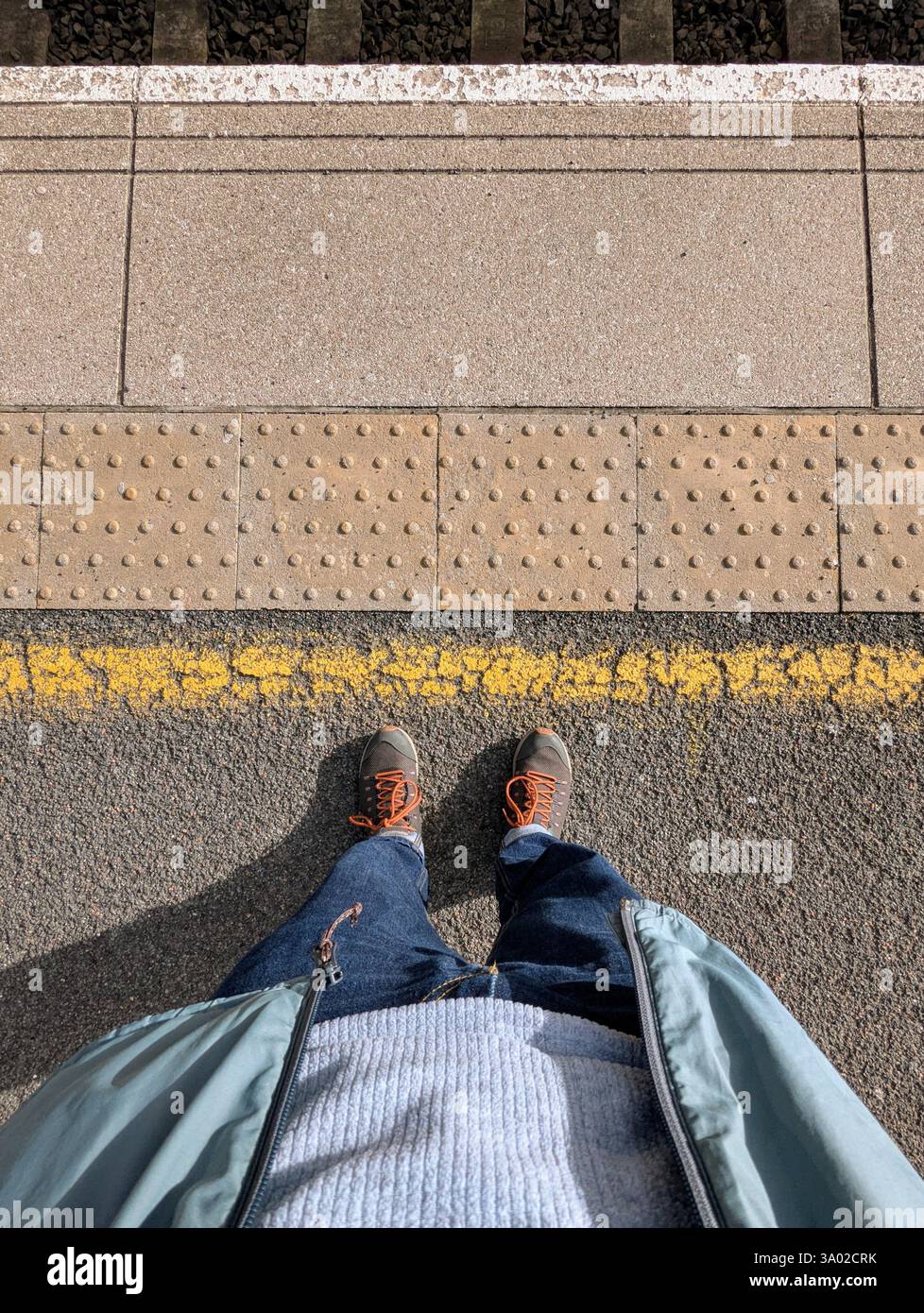 Railway safety in the UK - please stand behind the yellow line Stock ...