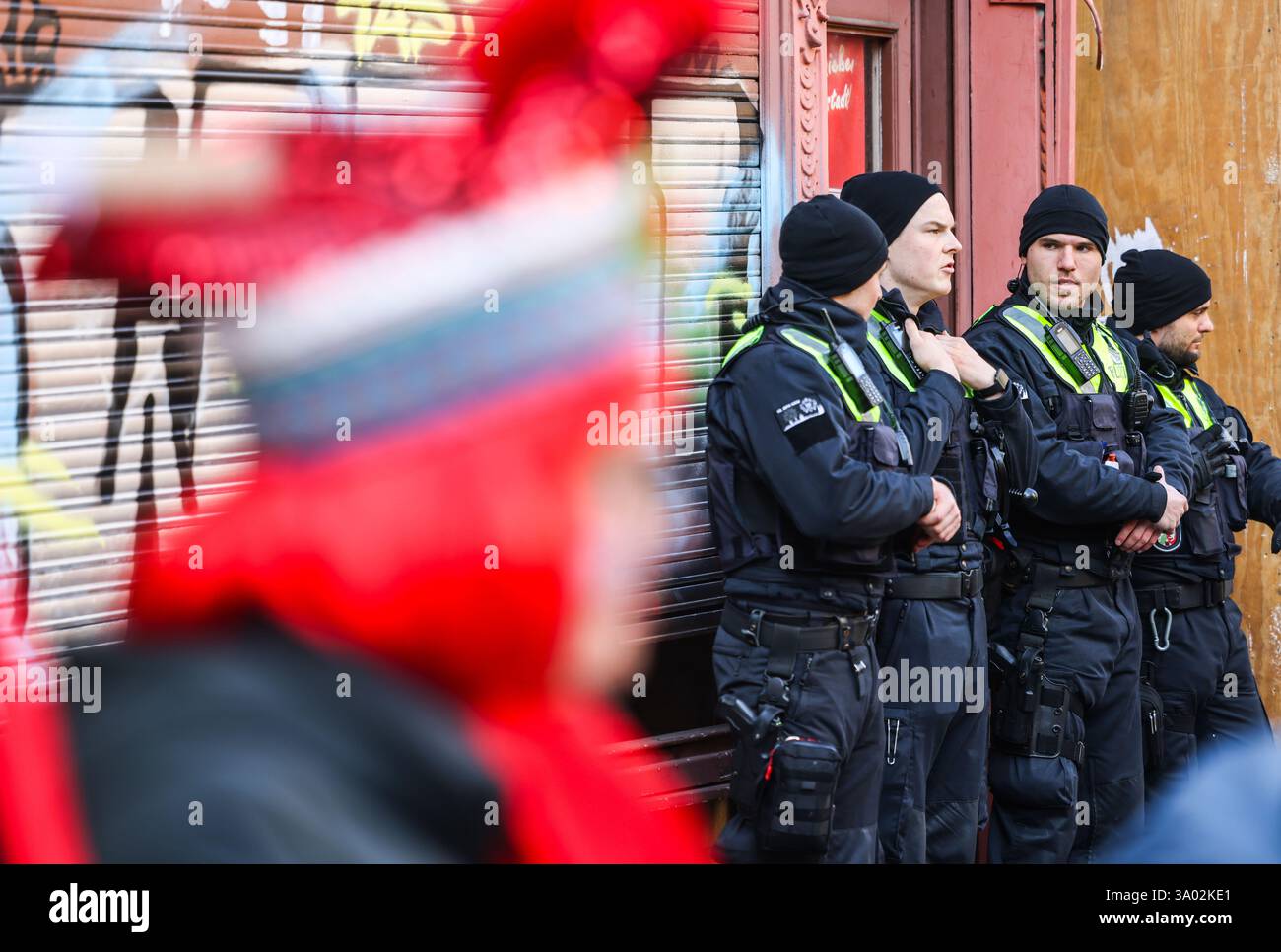 Cologne, Germany. 02nd Mar, 2025. Police officers stand at the side of ...