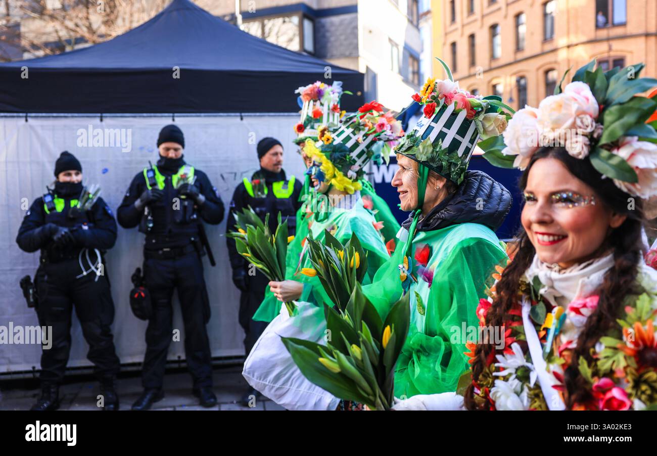 02 March 2025, North Rhine-Westphalia, Cologne: Carnival revellers take ...