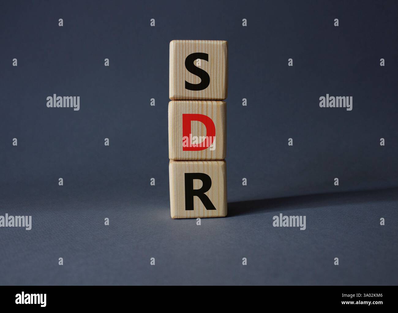 SDR, Special Drawing Rights. Wooden cubes with word SDR. Beautiful grey ...