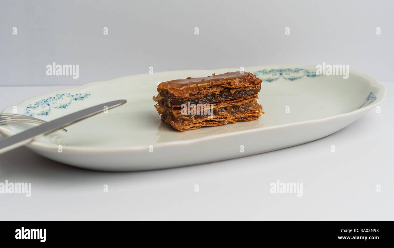 Delightful dessert featuring layered pastry with rich chocolate filling ...