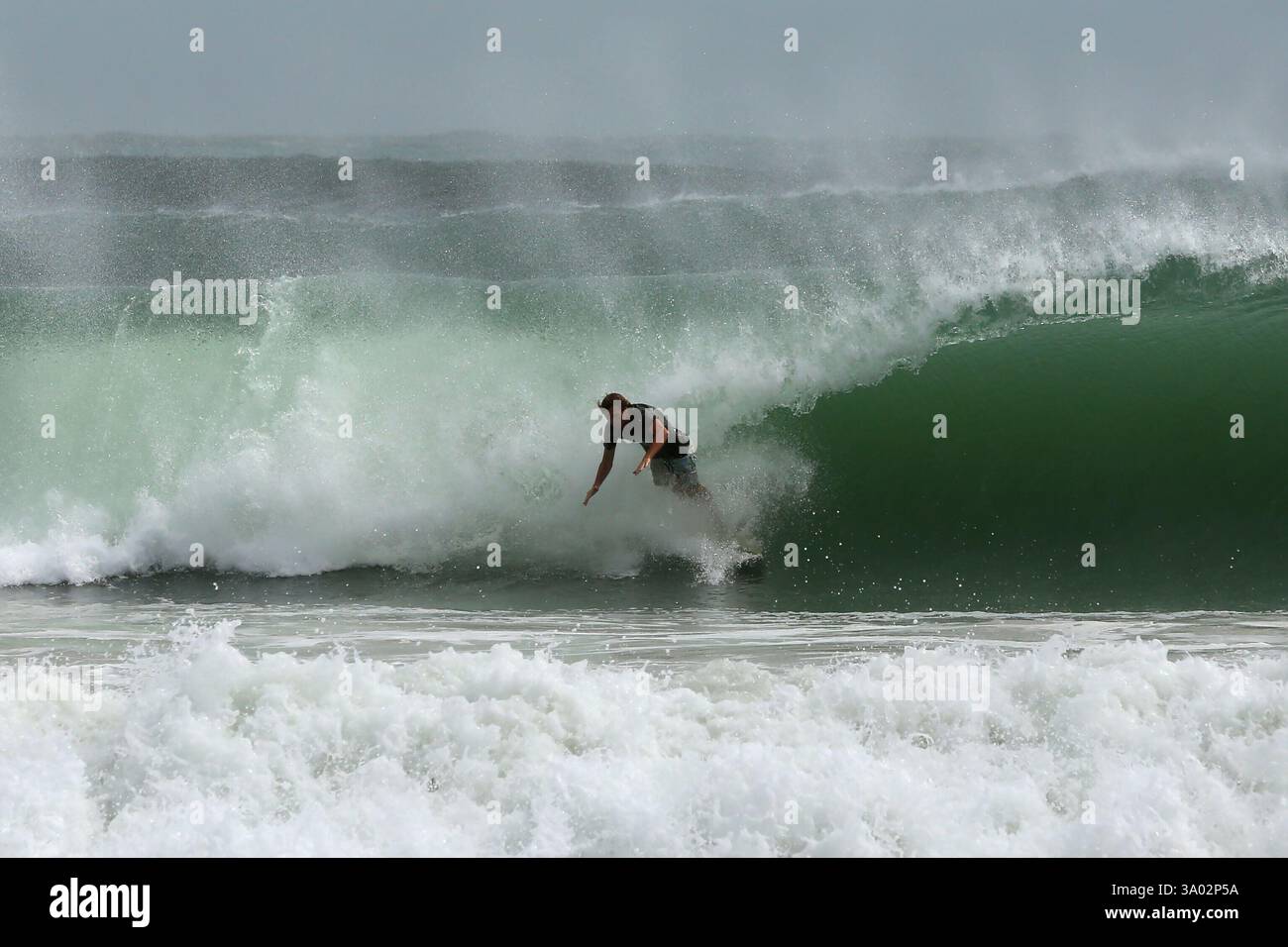 Brisbane, Australia. 02nd Mar, 2025. A surfer falls off their board at ...