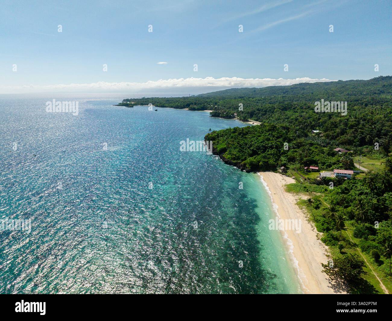 Aerial view of turquoise sea water with coral reefs with sun reflection ...