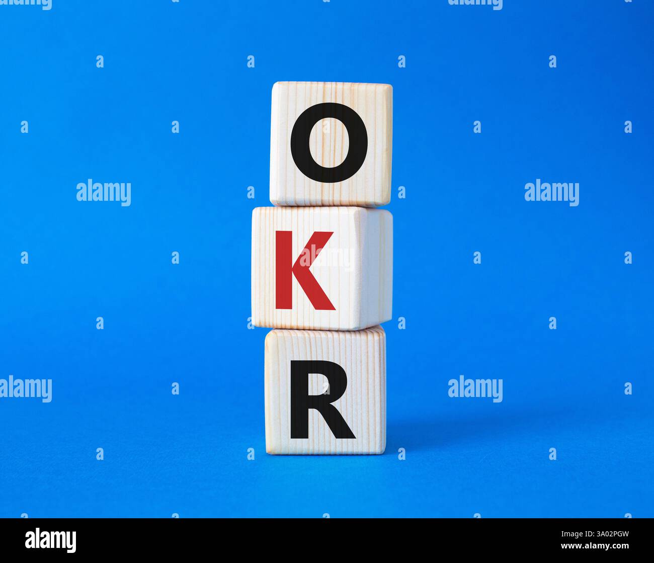 OKR objectives and key results symbol. Wooden cubes with words OKR ...