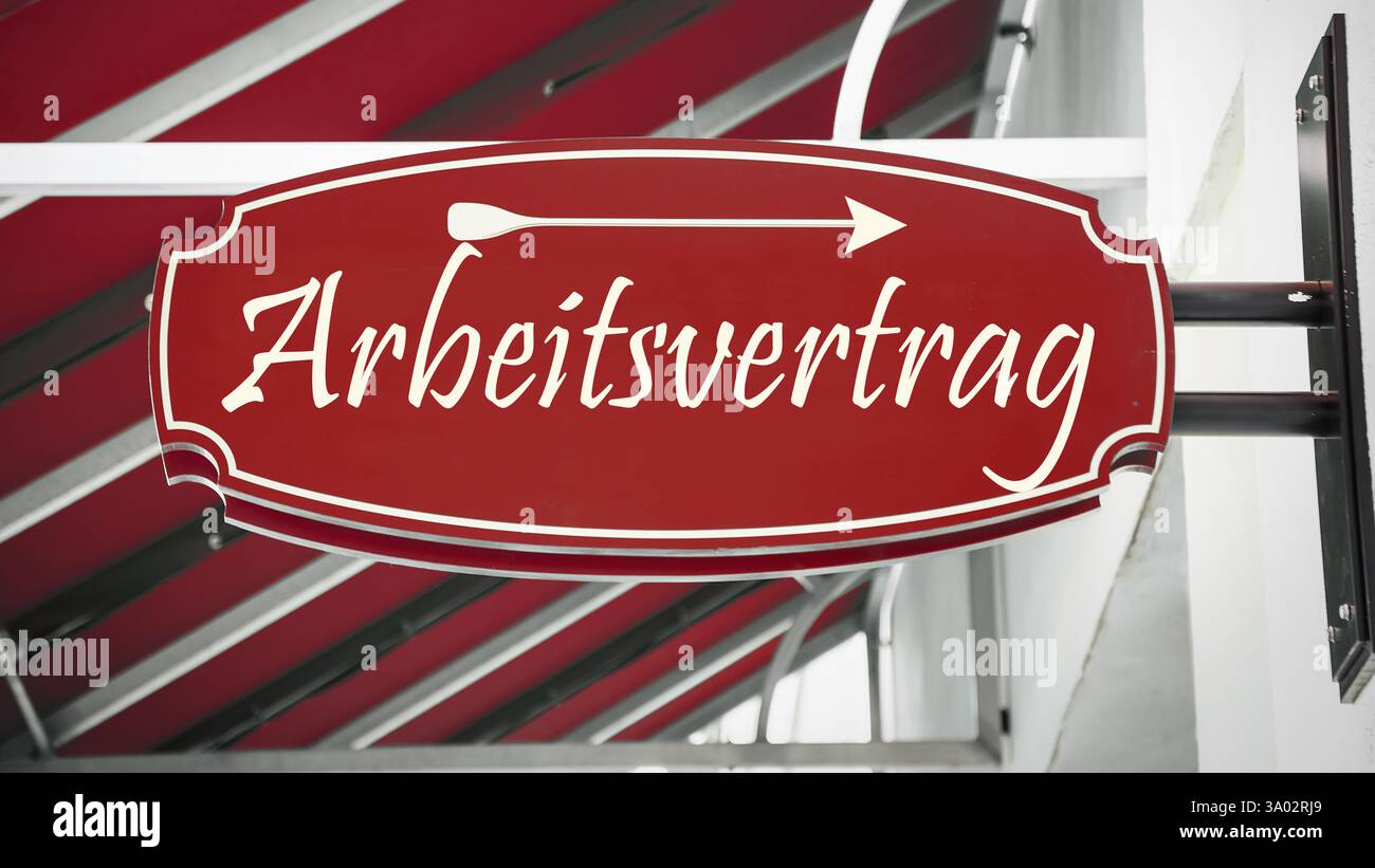 Image shows a signpost and a sign in the direction of an employment ...