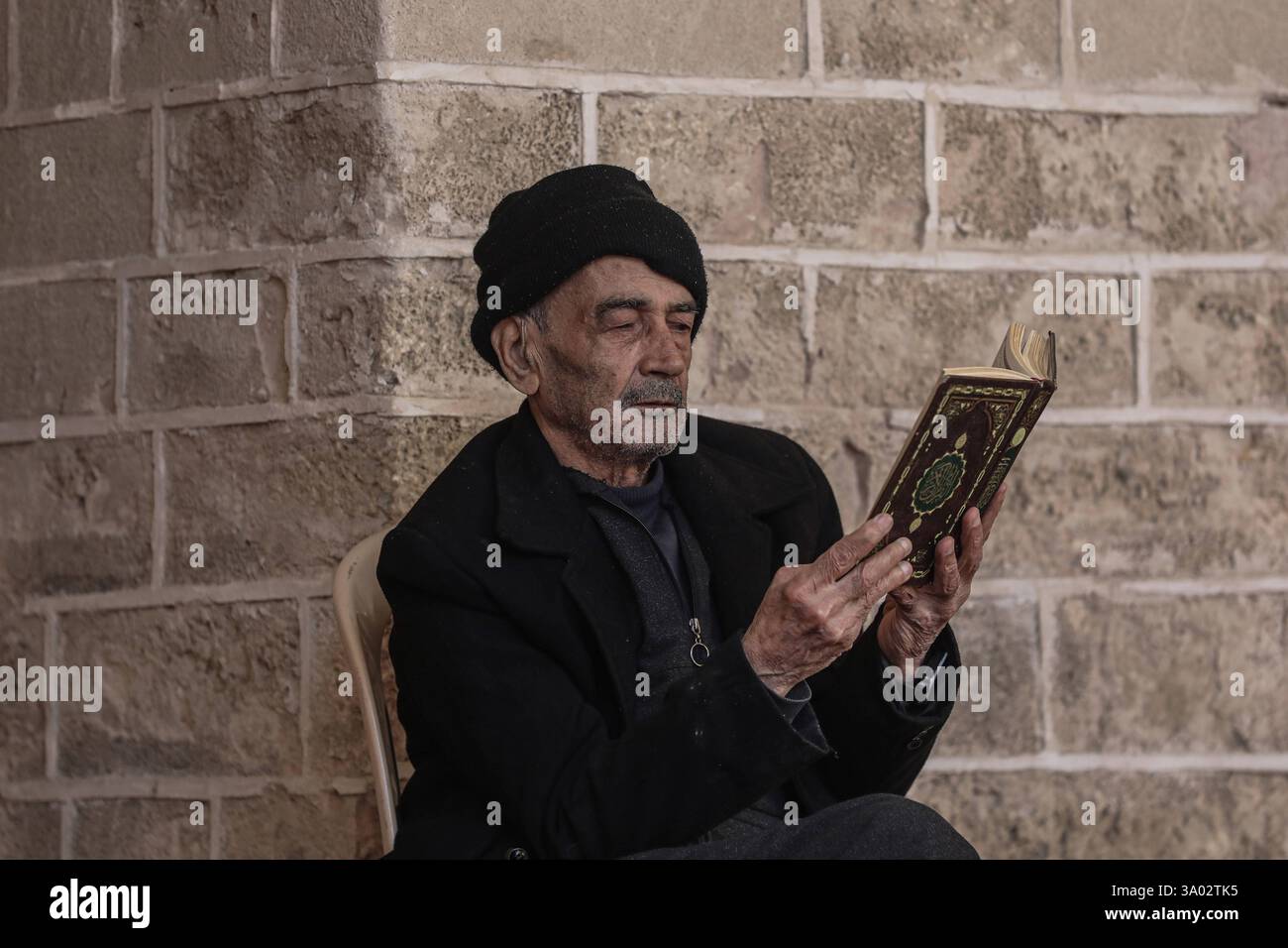 Muslim worshippers read from the Holy Quran as they sit at the historic ...