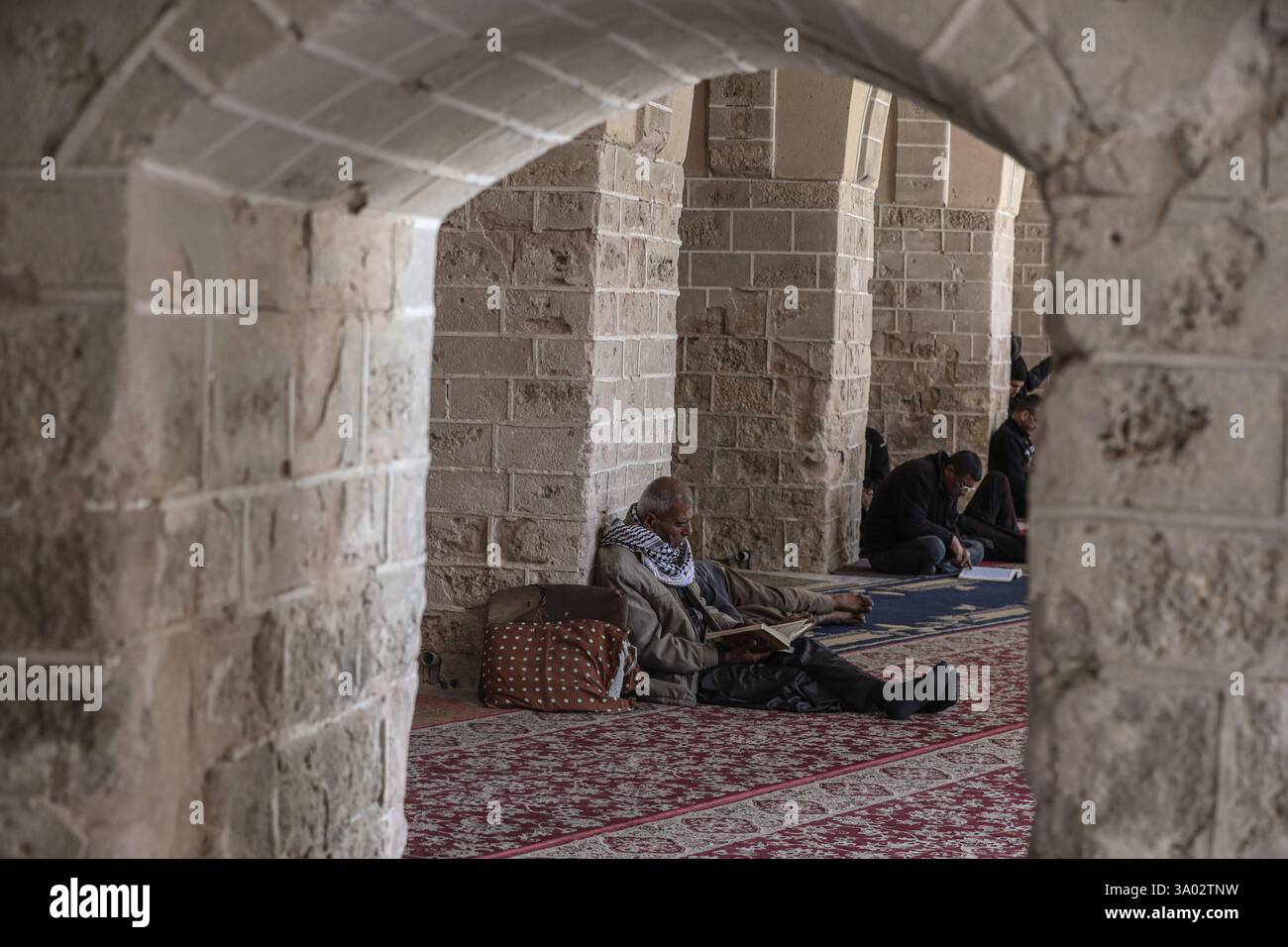 Muslim worshippers read from the Holy Quran as they sit at the historic ...