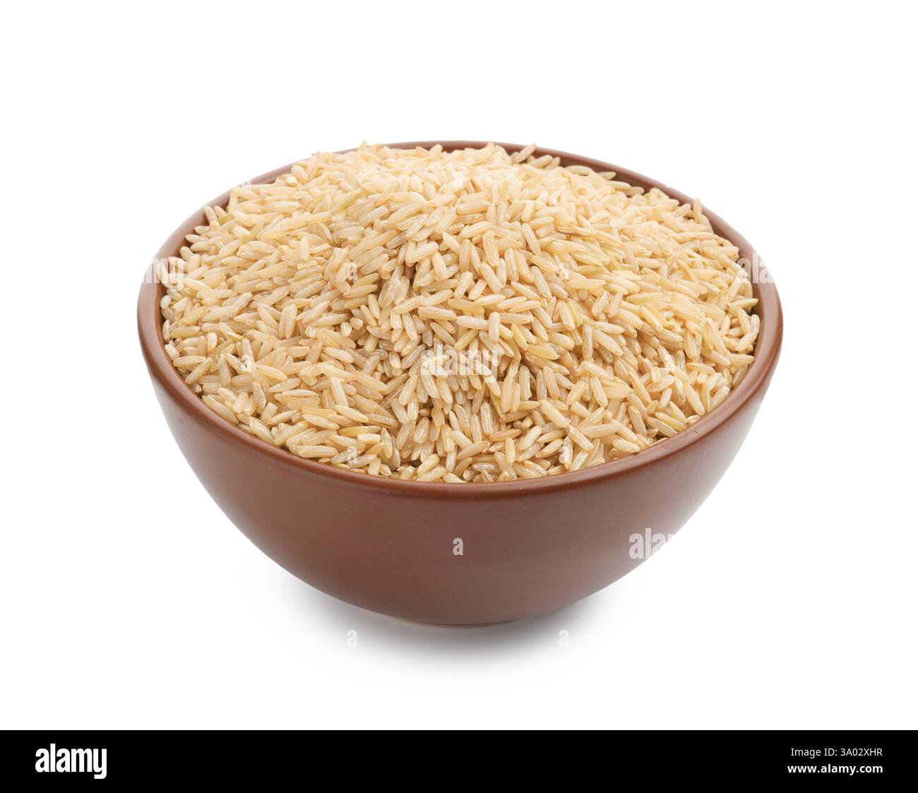 Raw brown rice in bowl isolated on white Stock Photo - Alamy