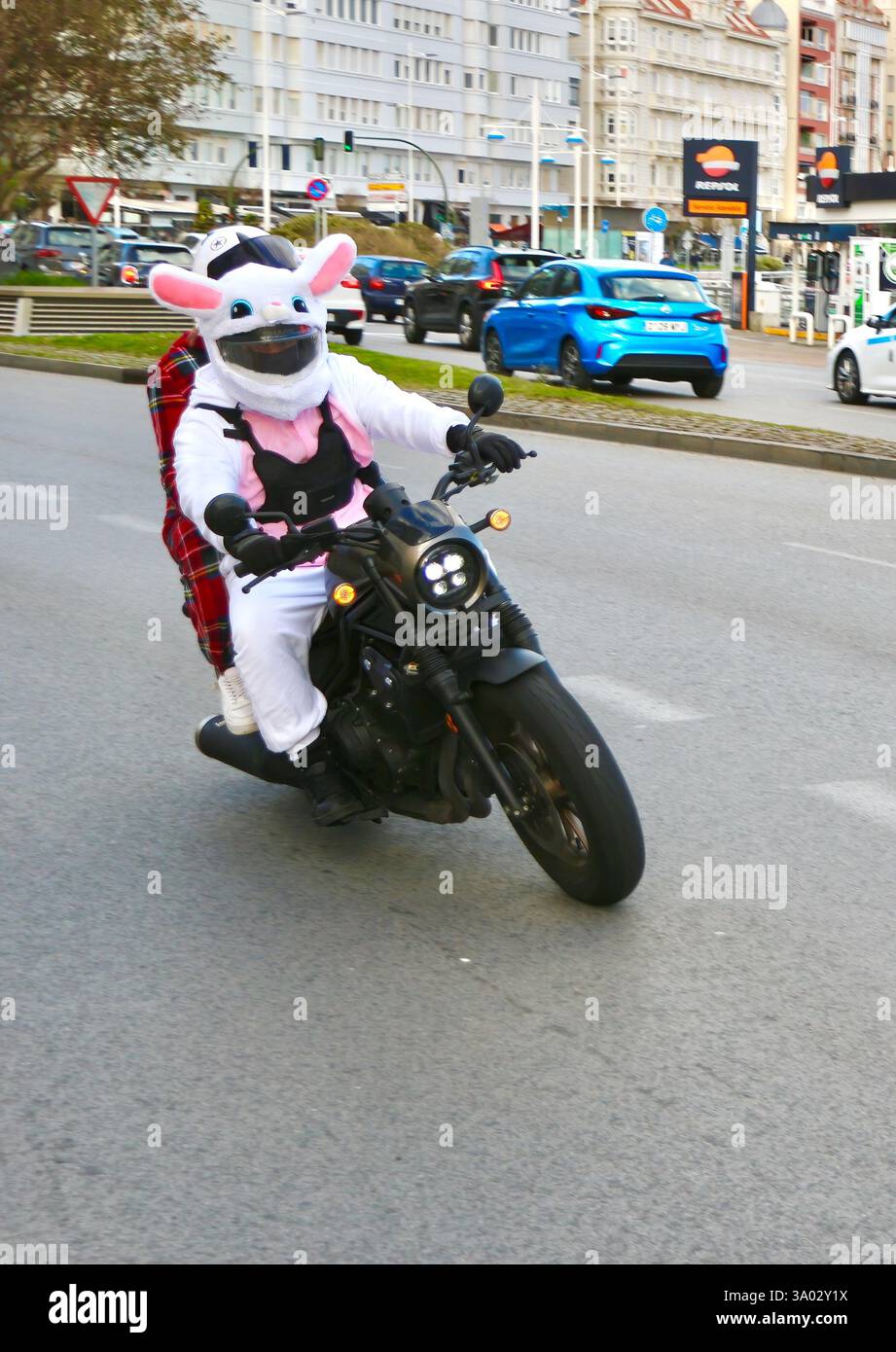 Motorbike rider arriving to the evening carnival parade wearing a ...