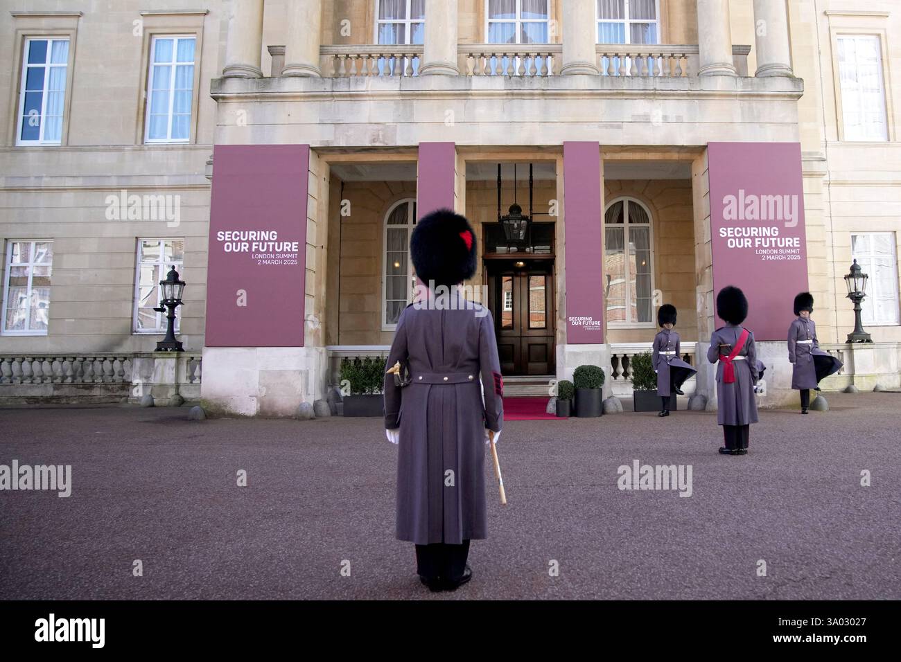 Soldiers take their places prior to arrivals for a summit on Ukraine at ...