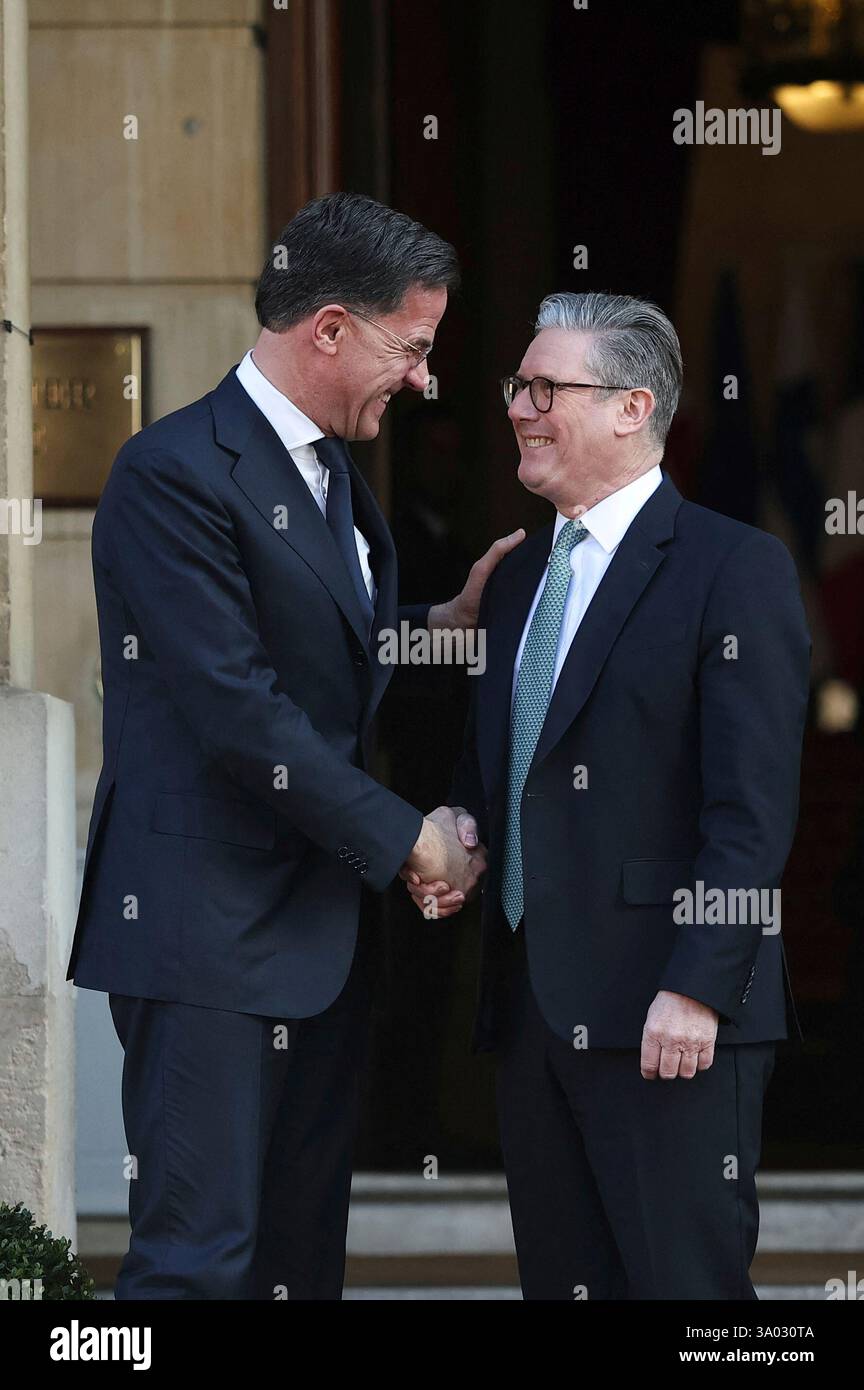 Britain's Prime Minister Keir Starmer, right, welcomes NATO Secretary ...