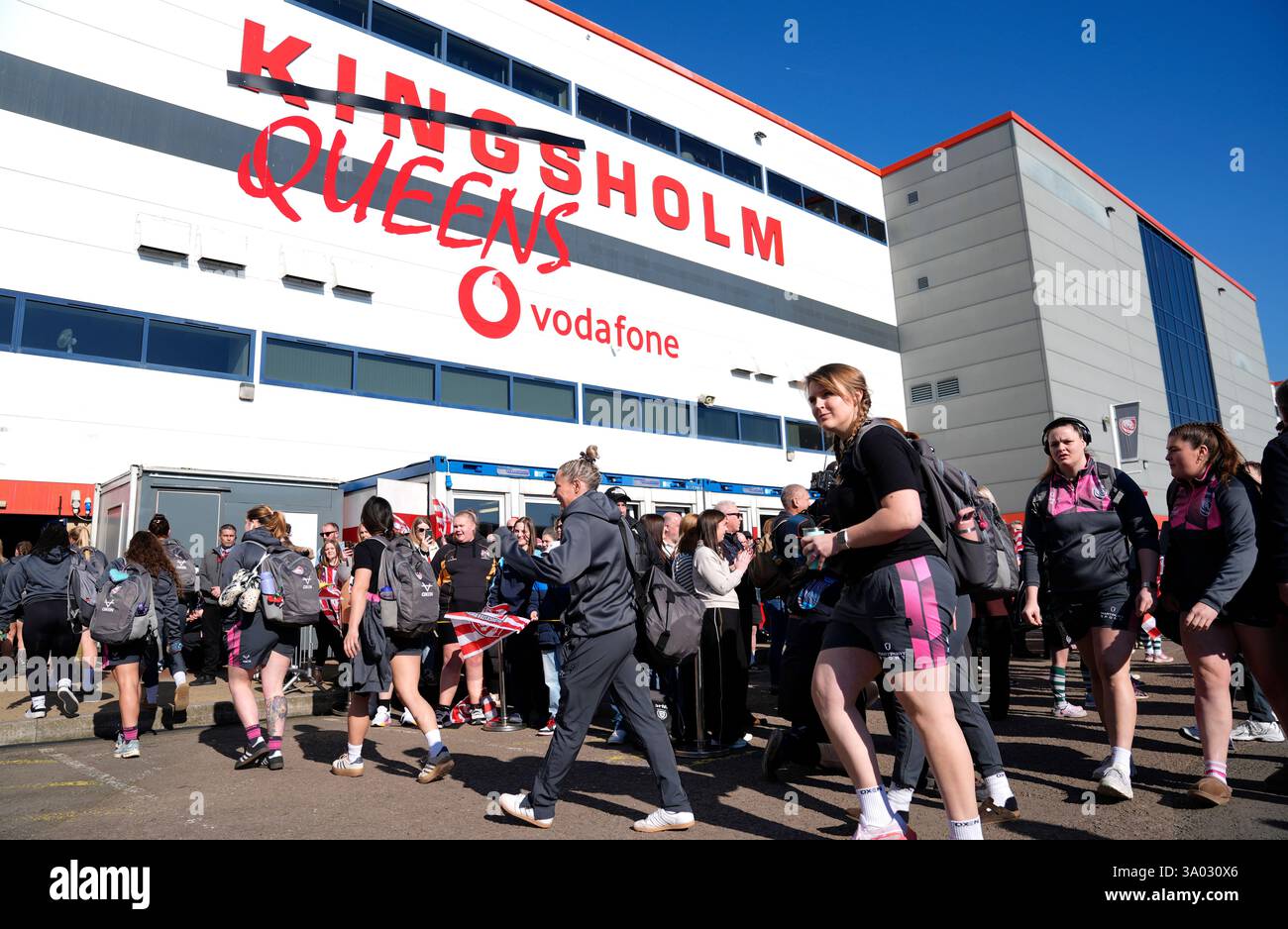 Gloucester-Hartpury players arrive to the stadium as fans look on ahead ...