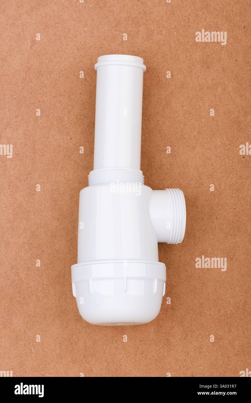 White plastic sink drain trap with threaded ends and overflow pipe ...