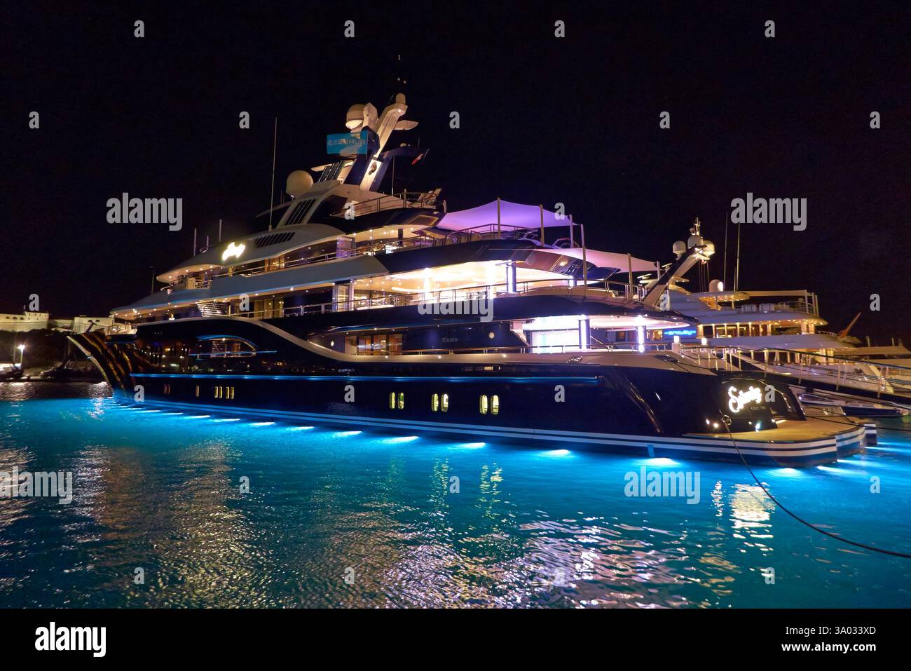 Luxury Superyacht Illuminated at Night in a Calm Marina Stock Photo - Alamy