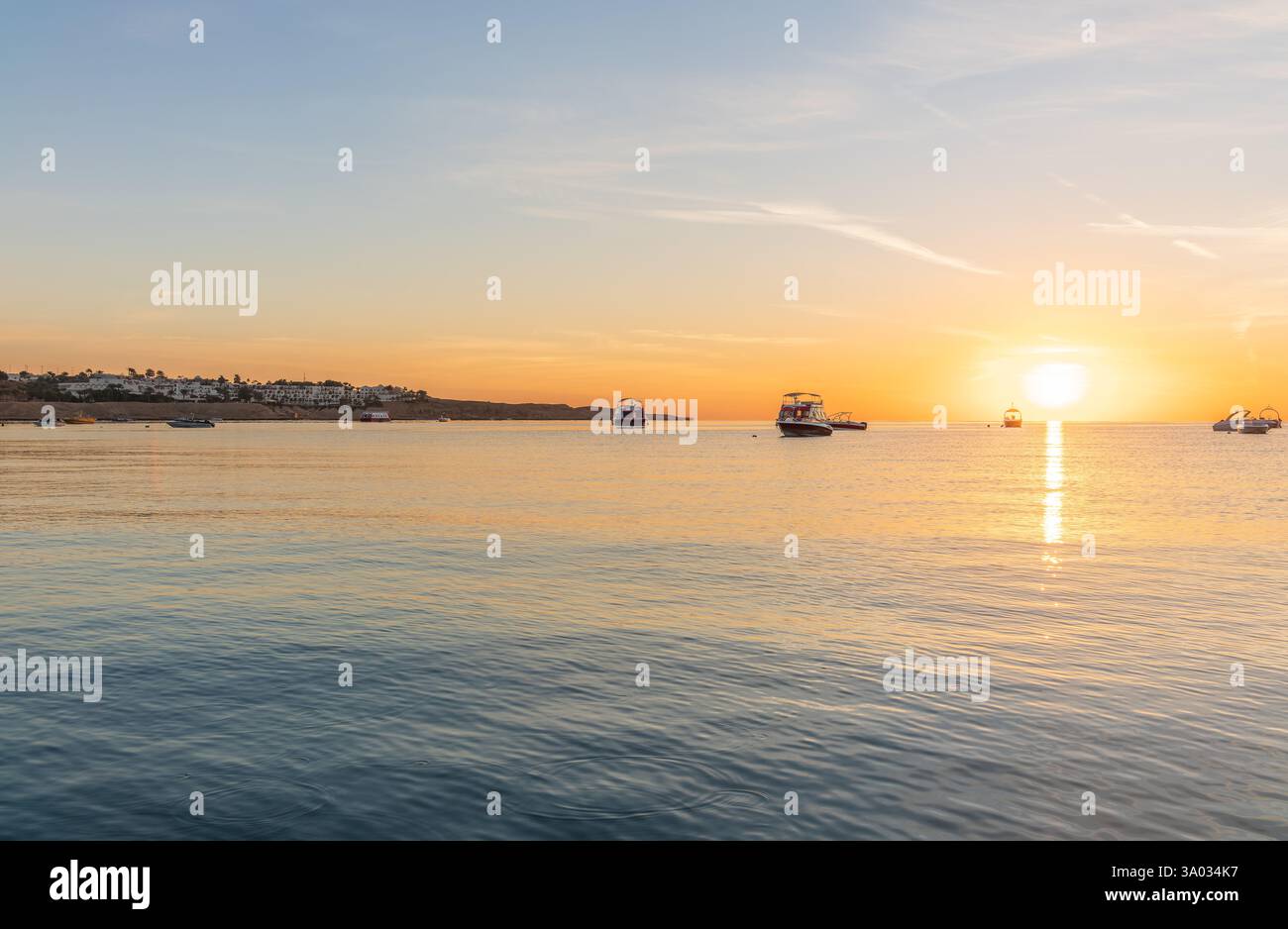 Sunrise over the sea. Panoramic seascape. Burning sky and shining ...