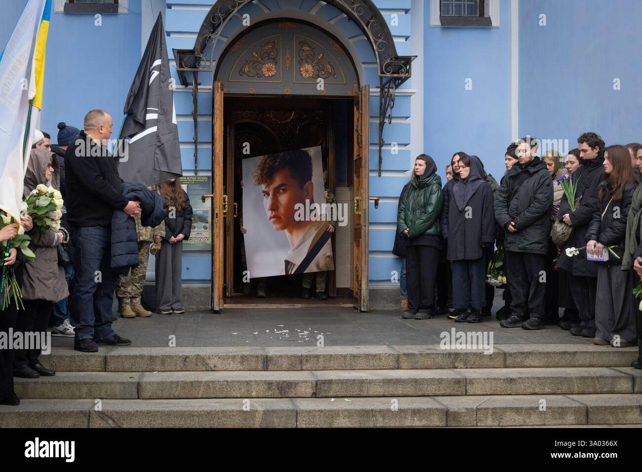 Servicemen carry portrait of volunteer soldier Volodymyr Rakov, 30, a ...