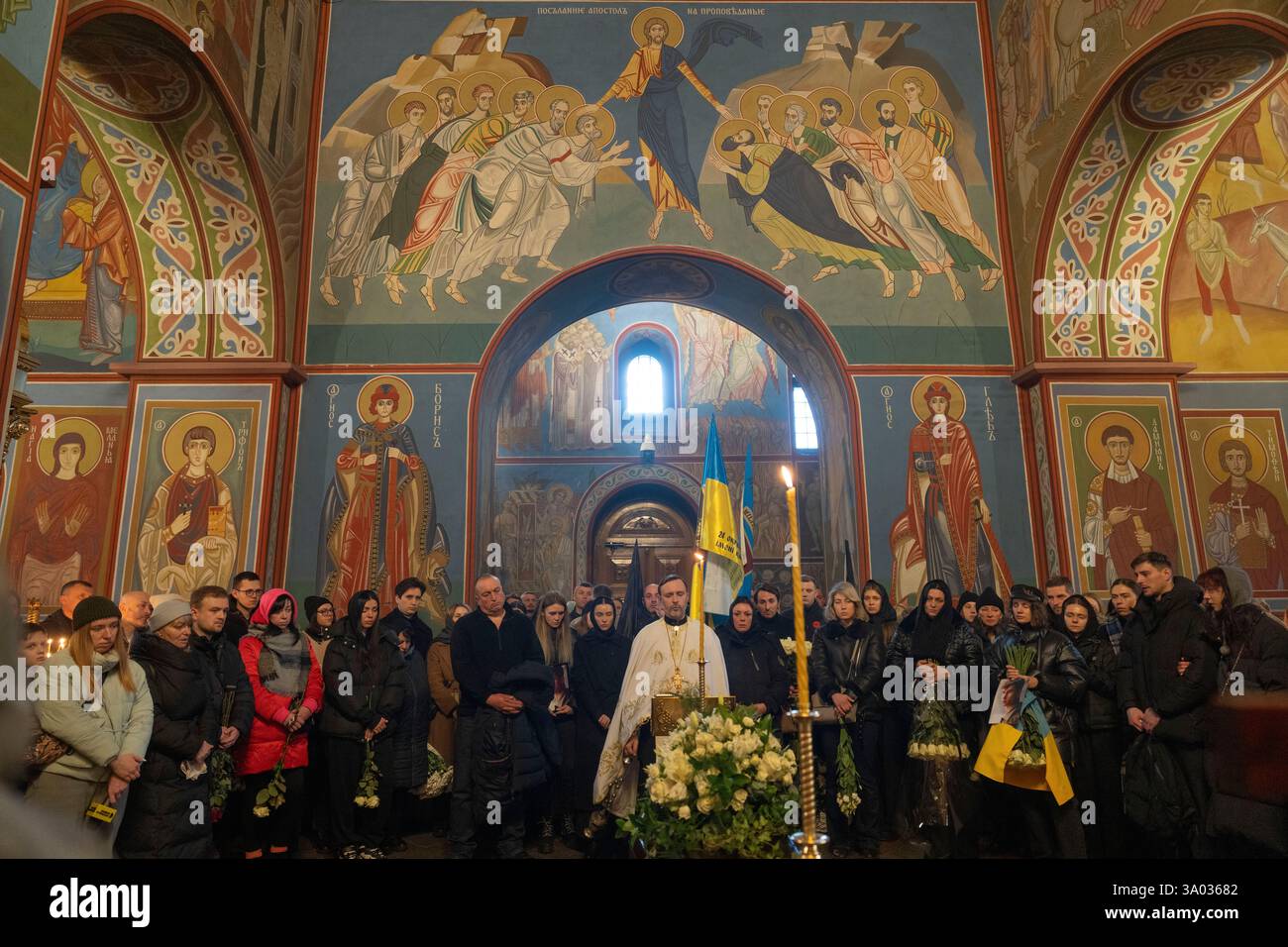 People mourn over a coffin of volunteer soldier Volodymyr Rakov, 30, a ...