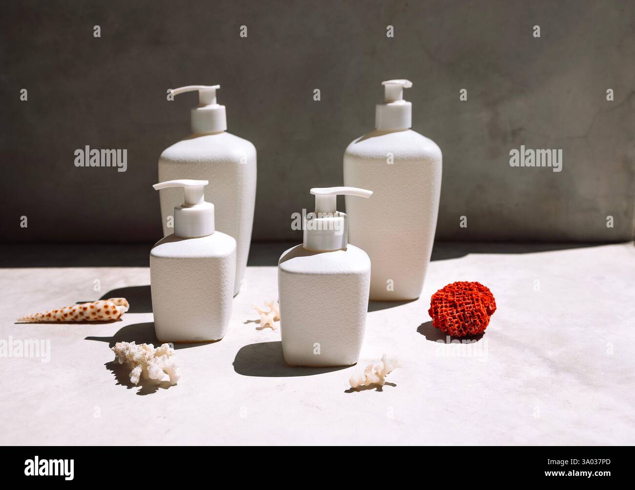 A collection of white mock-ups of jars with dispensers on a marble ...