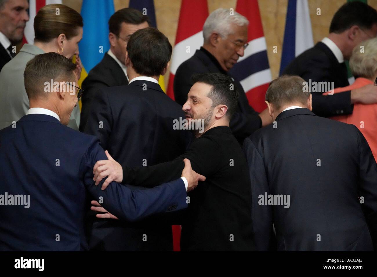 Ukraine's President Volodymyr Zelenskyy, center, speaks with Finland's ...
