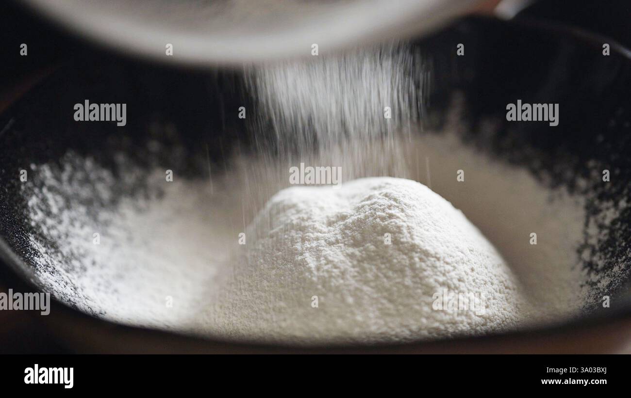 Sifting flour through metal sifter hi-res stock photography and images ...