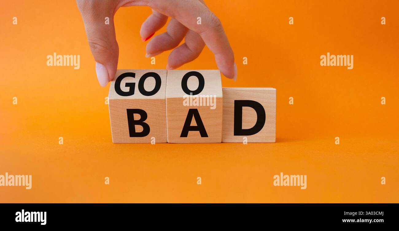 Good vs Bad symbol. Businessman Hand turns cubes and changes word Bad ...