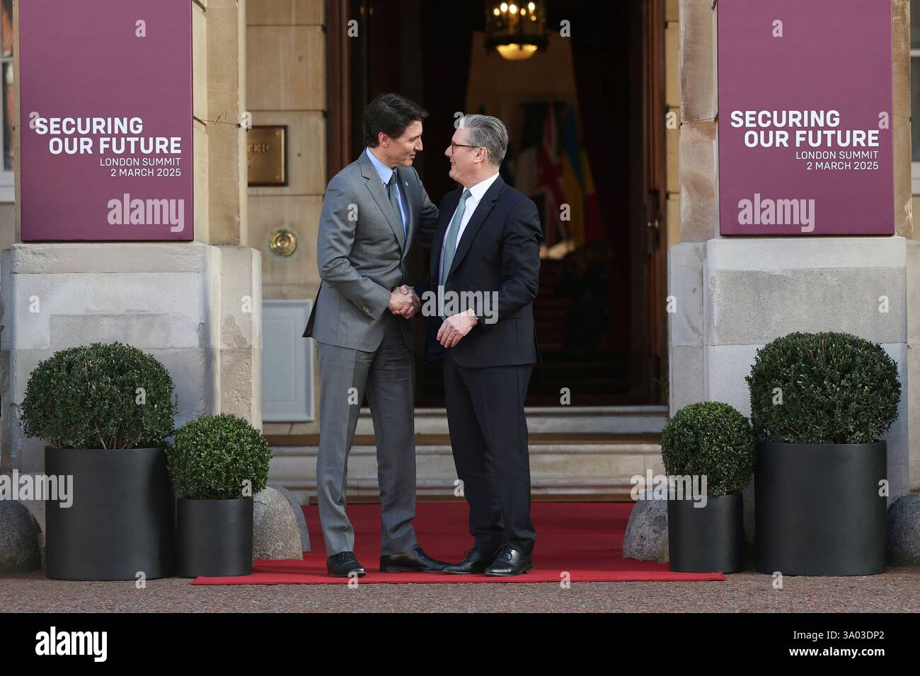 Britain's Prime Minister Keir Starmer, right, welcomes Canadian Prime ...