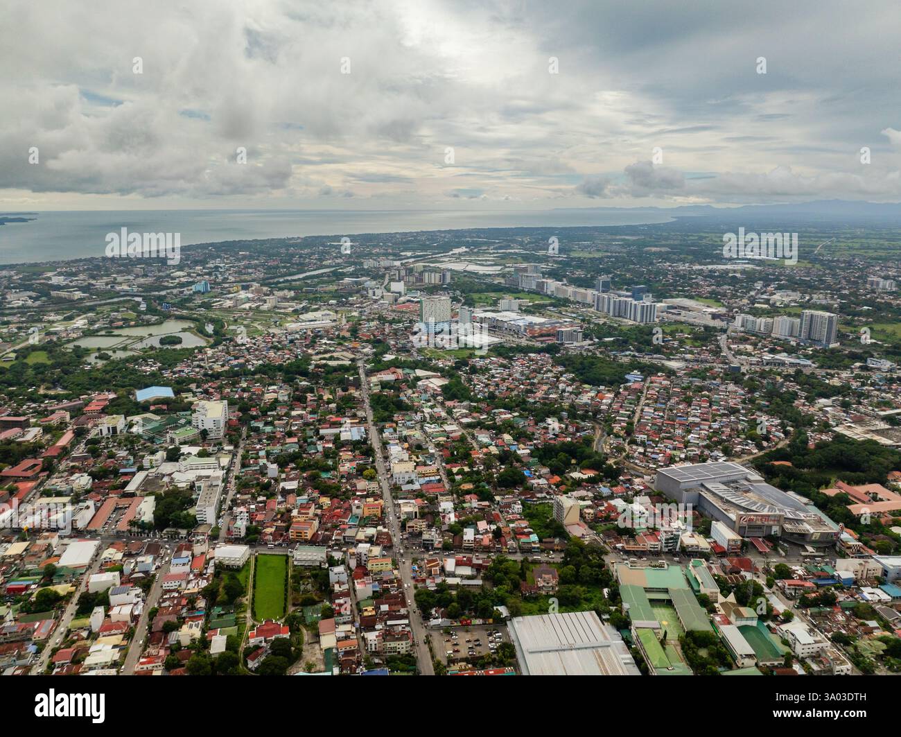 Drone view of Iloilo City with houses and colonial churches. Panay ...