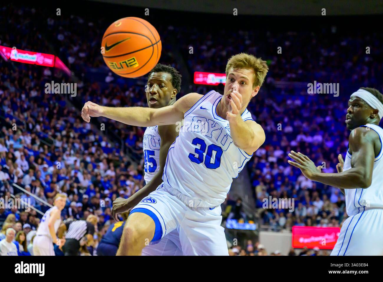 BYU guard Dallin Hall (30) attempts to collect the loose basketball ...